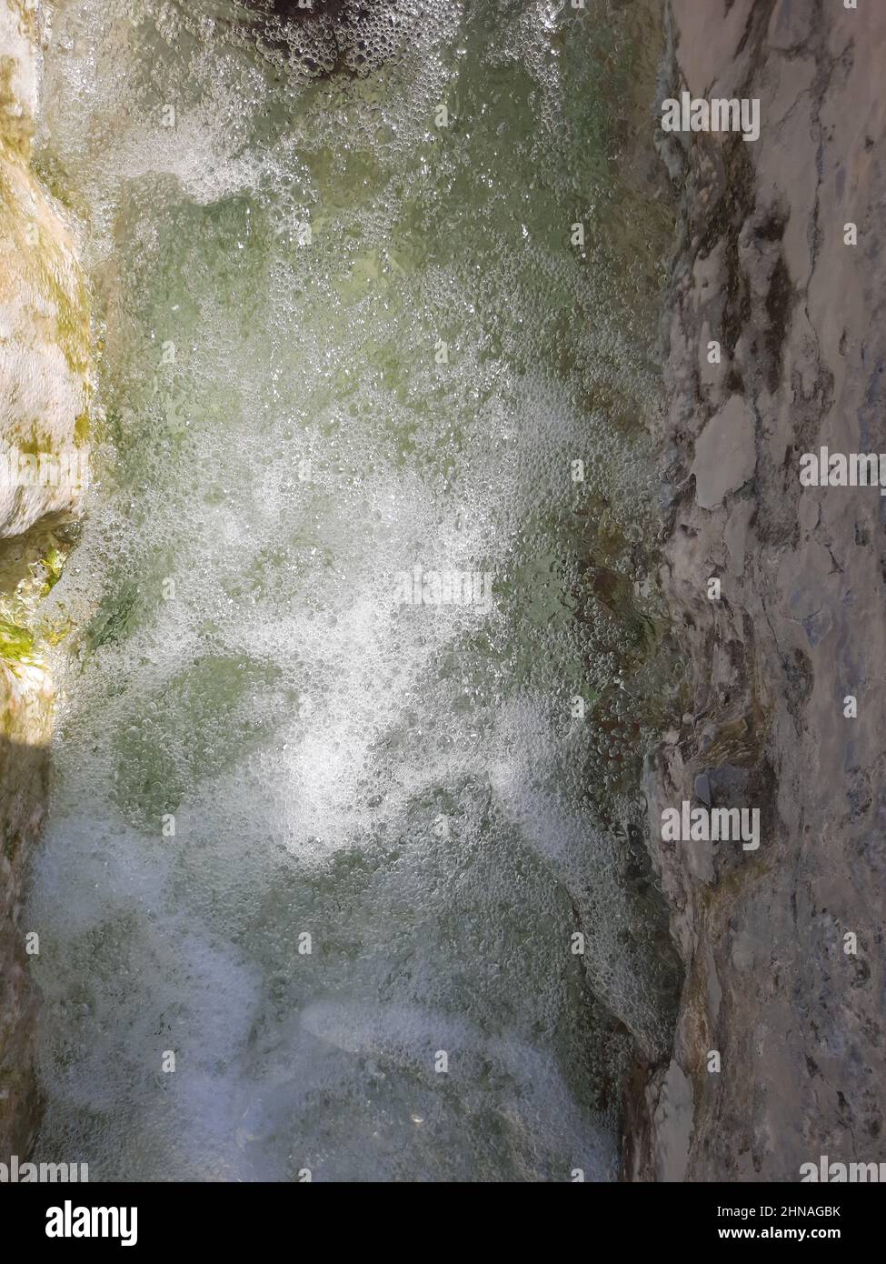 Background of mineral water flow from a spring in Pamukkale, Turkey ...
