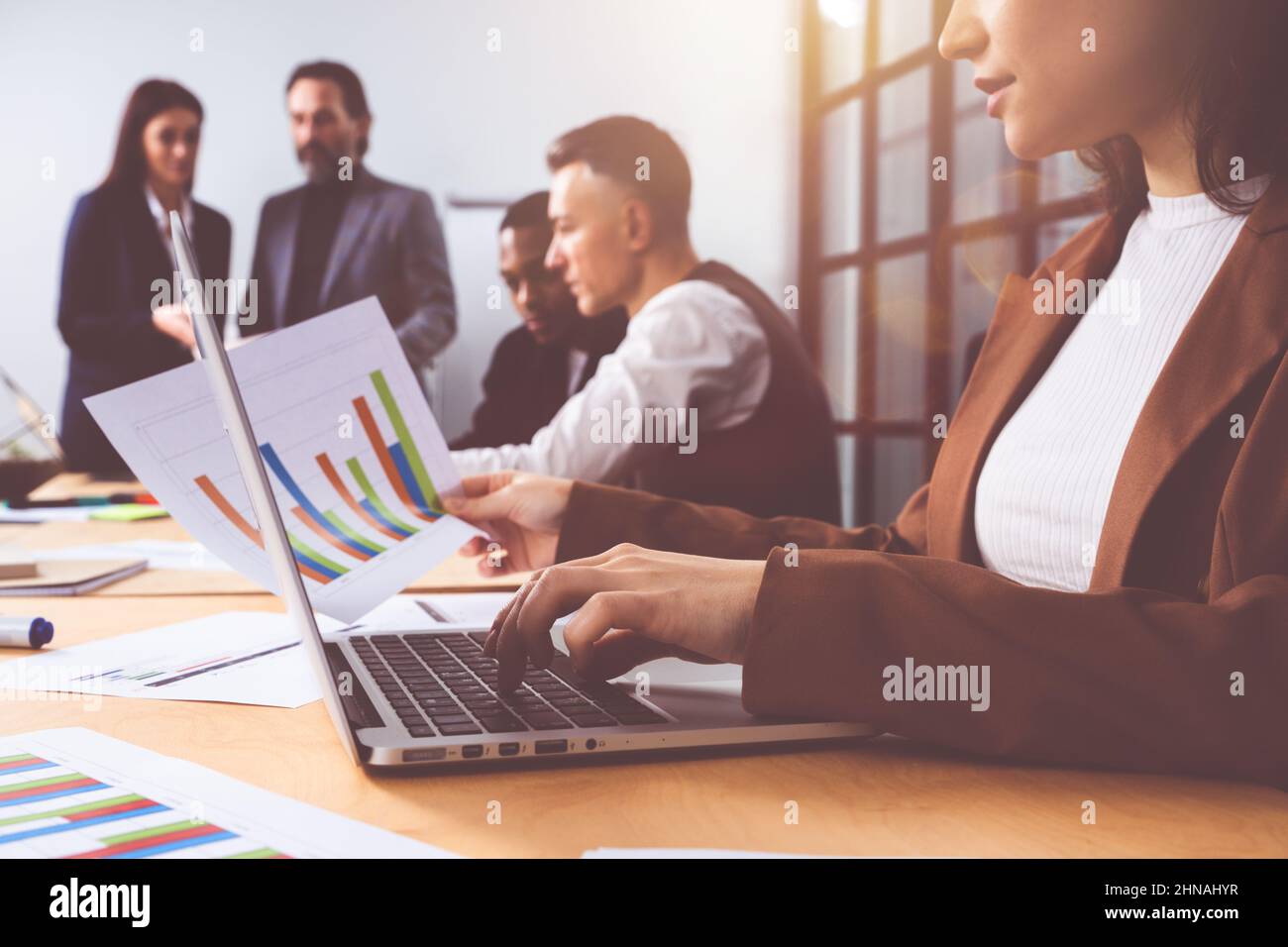 Group of business people have a meeting about company stats Stock Photo ...