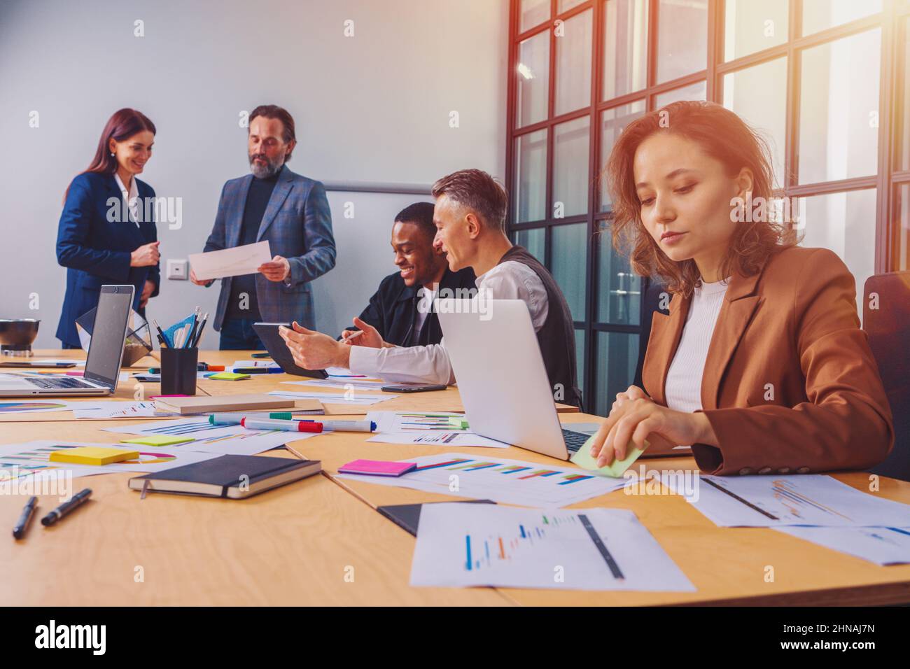 Group of business people have a meeting about company stats Stock Photo ...