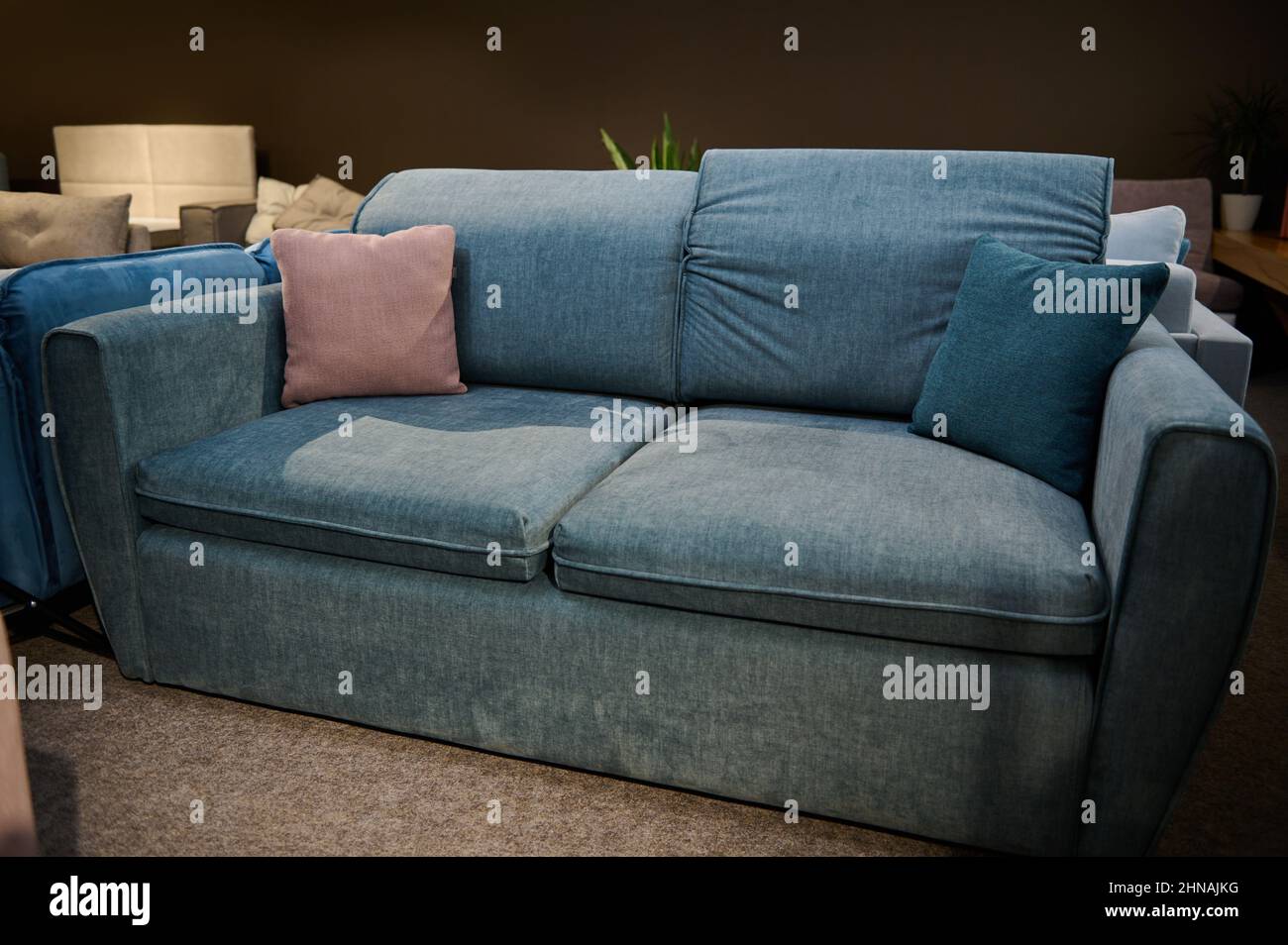 Beautiful minimalist stylish blue pastel sofa with a light pink colored ...