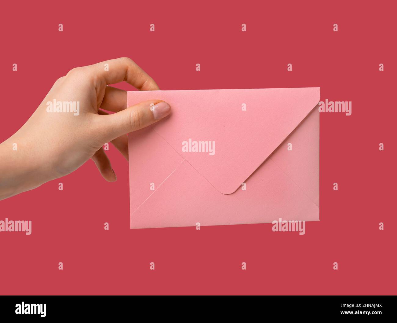 Woman hand holding envelope invitation hi-res stock photography and ...