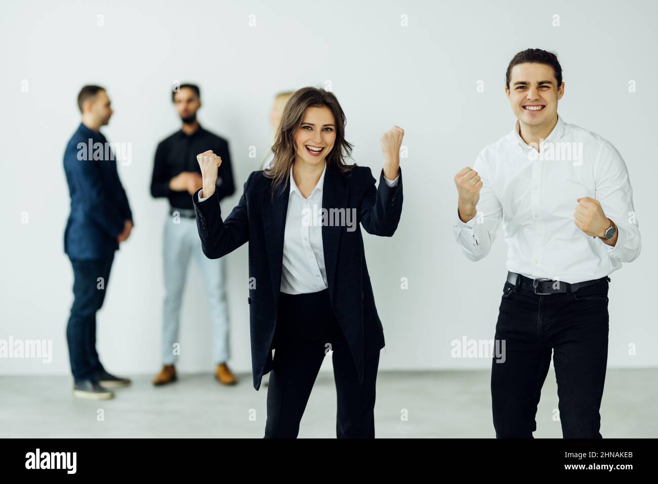 Business team celebrating a triumph with arms up Stock Photo - Alamy