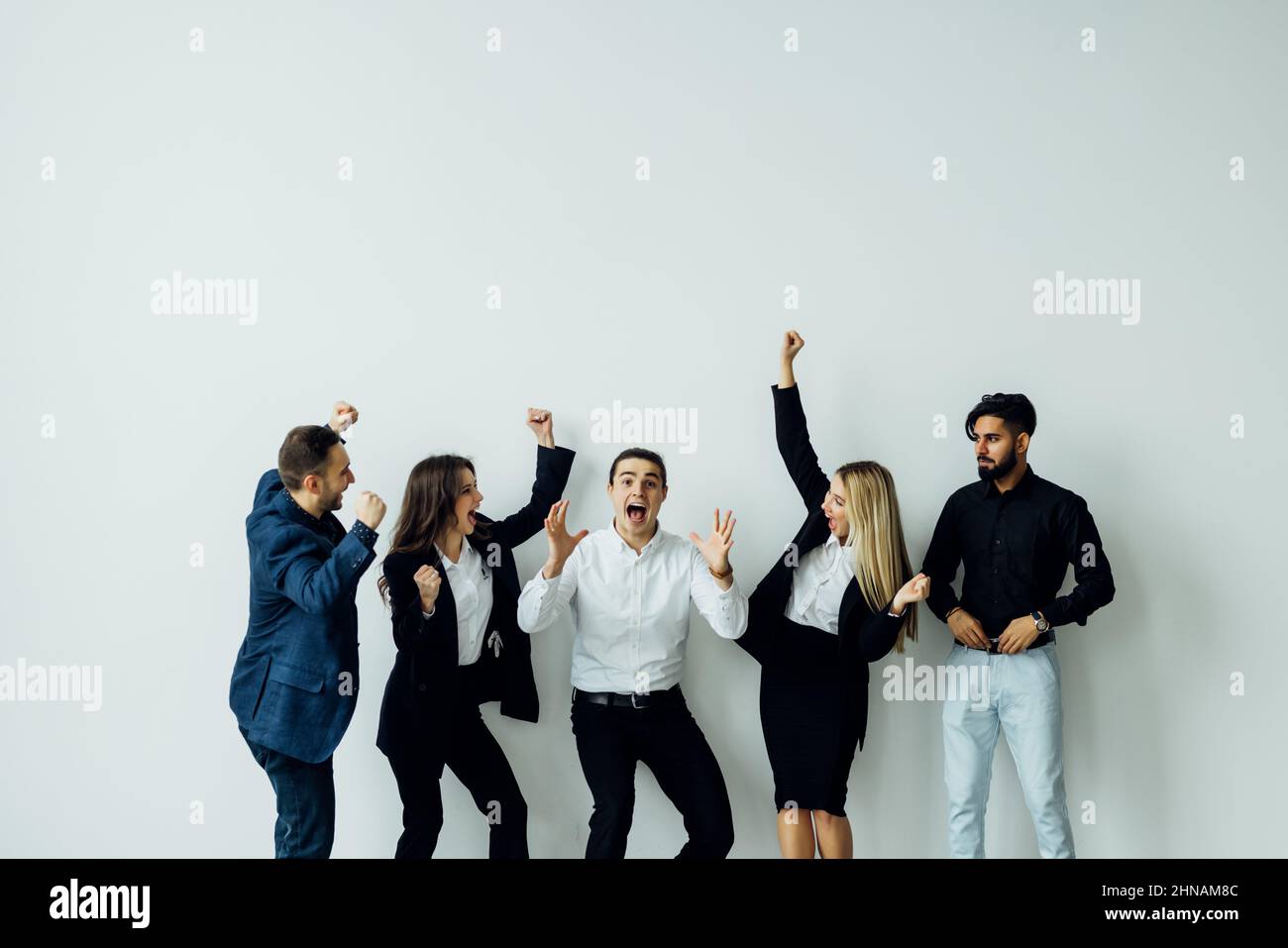 Successful businessman cheering team hi-res stock photography and ...