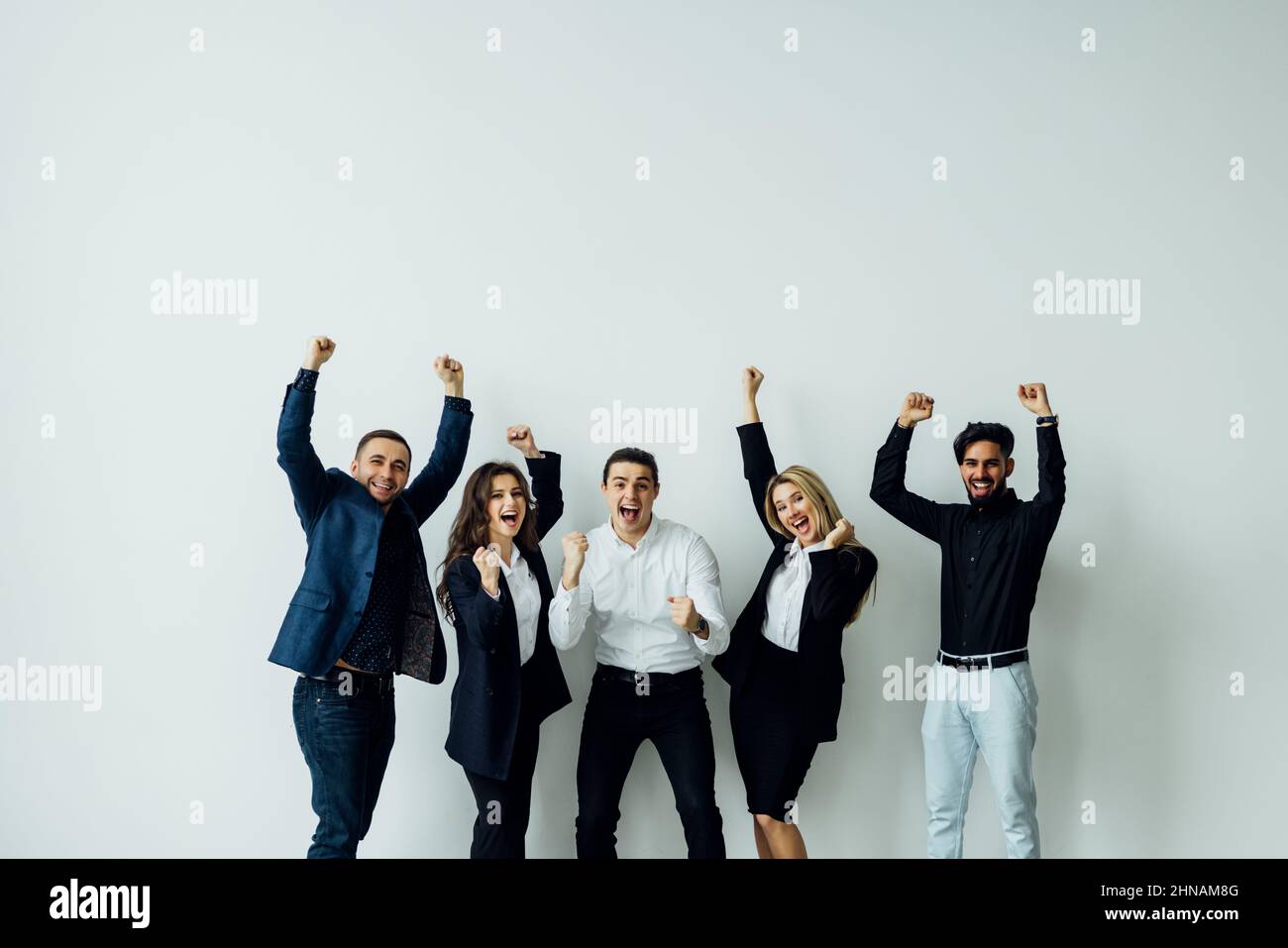 Cheerful active multiracial colleagues dancing enjoy corporate party or ...