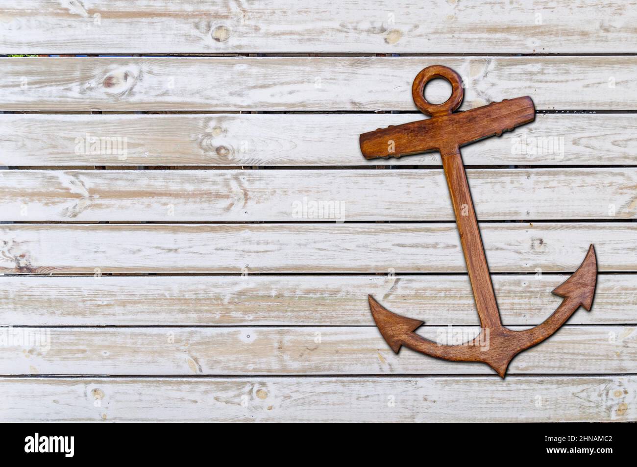 Wooden ancor on the white wooden texture background Stock Photo - Alamy