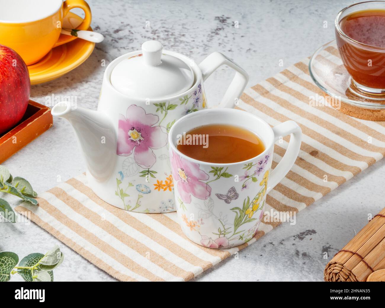 Healthy Ginger tea with lemon in beautiful cup on mat with grey ...
