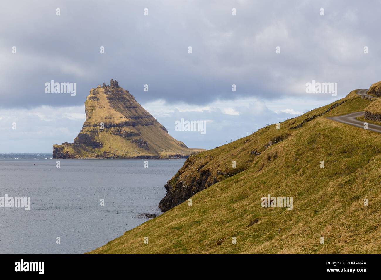 View of the coast near Bour on the island of Vagar. Massive cliffs ...