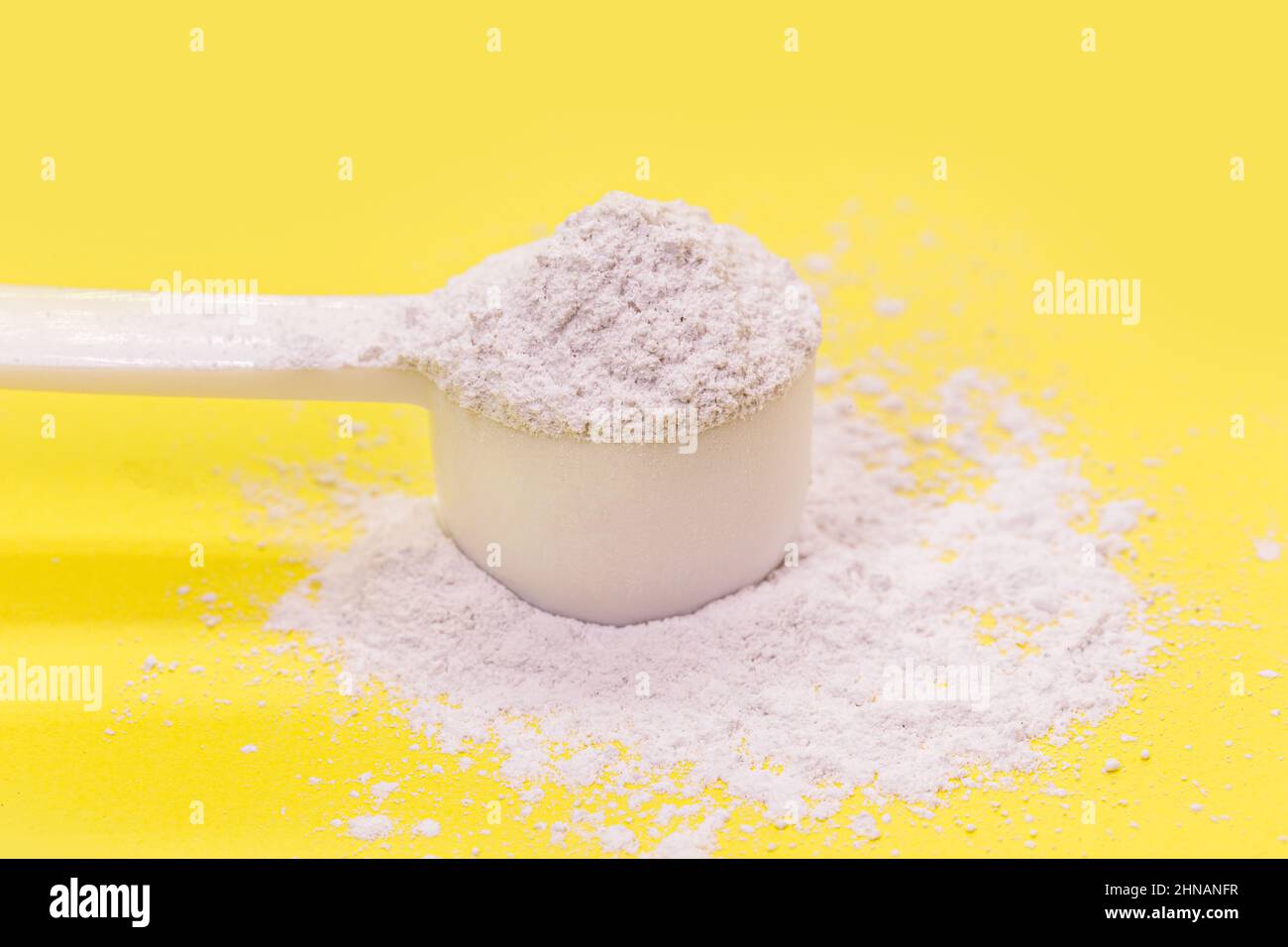 measuring spoon with casein or caffeine powder, food supplement ...