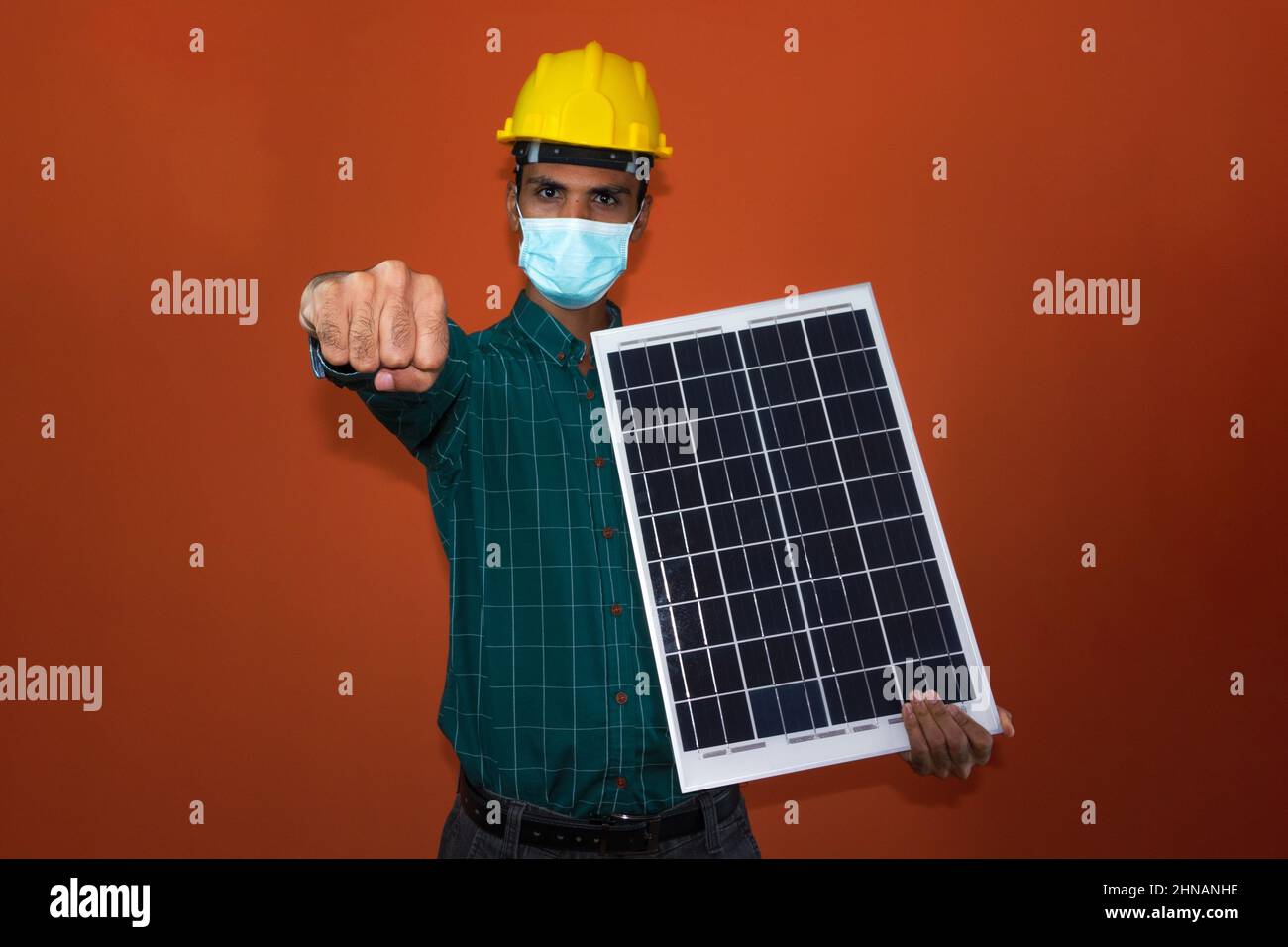 Worker With Helmet and Pandemic Mask Holding a Solar Photovoltaic Panel ...