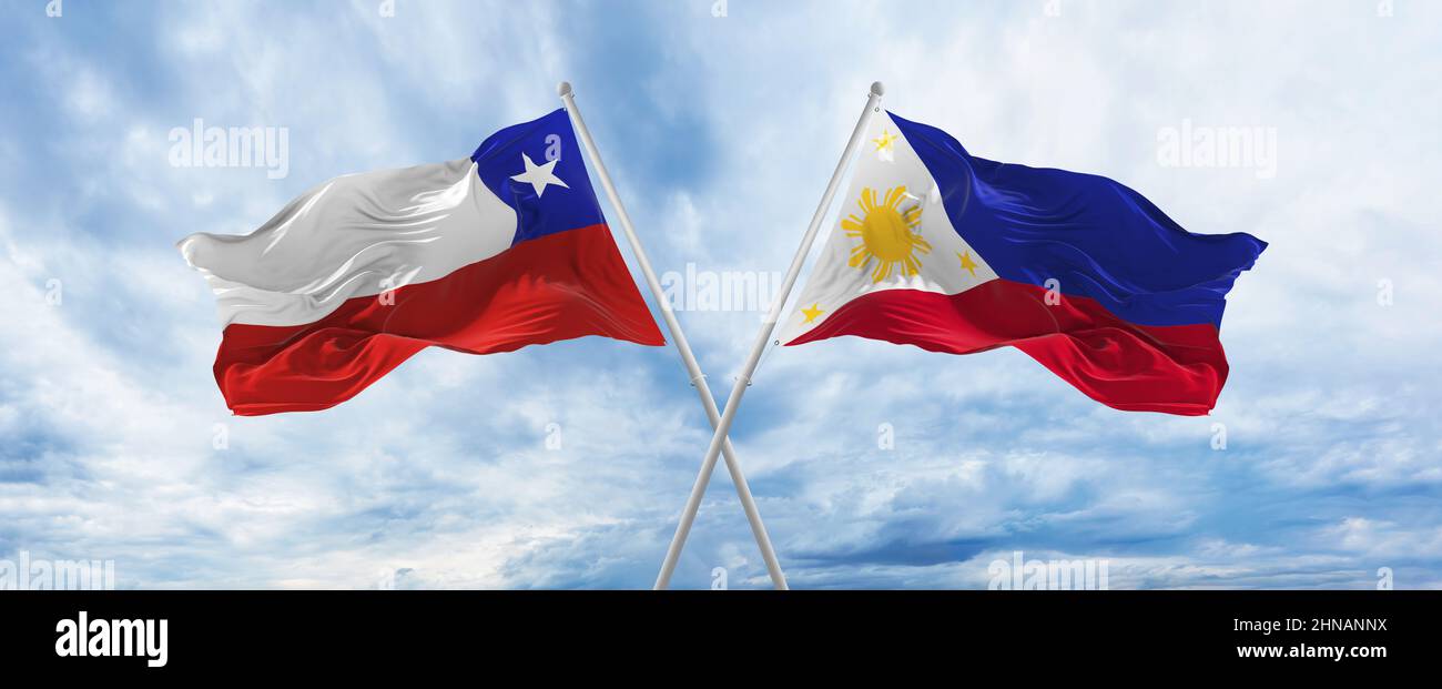 crossed national flags of Chile and Philippines flag waving in wind at ...