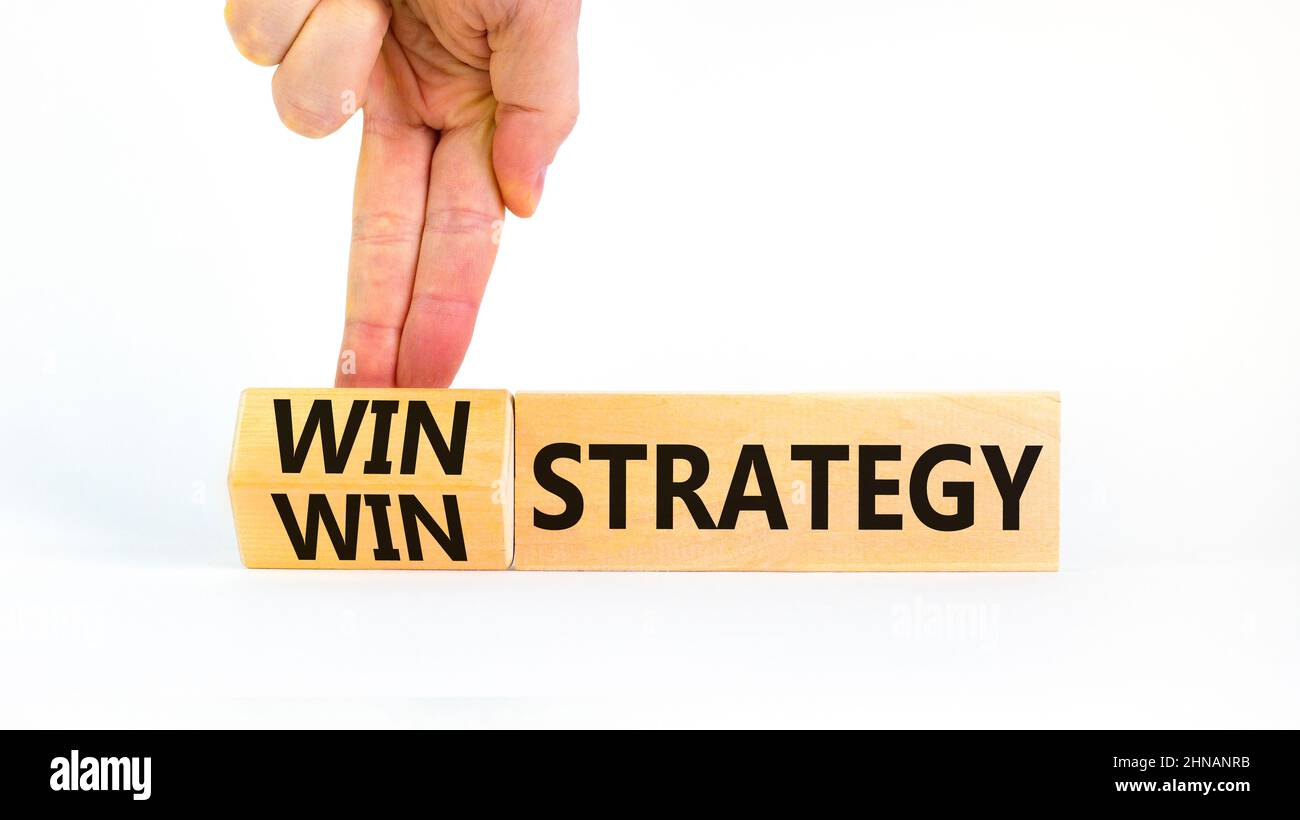 Win-win strategy symbol. Businessman turns wooden cubes with words win ...
