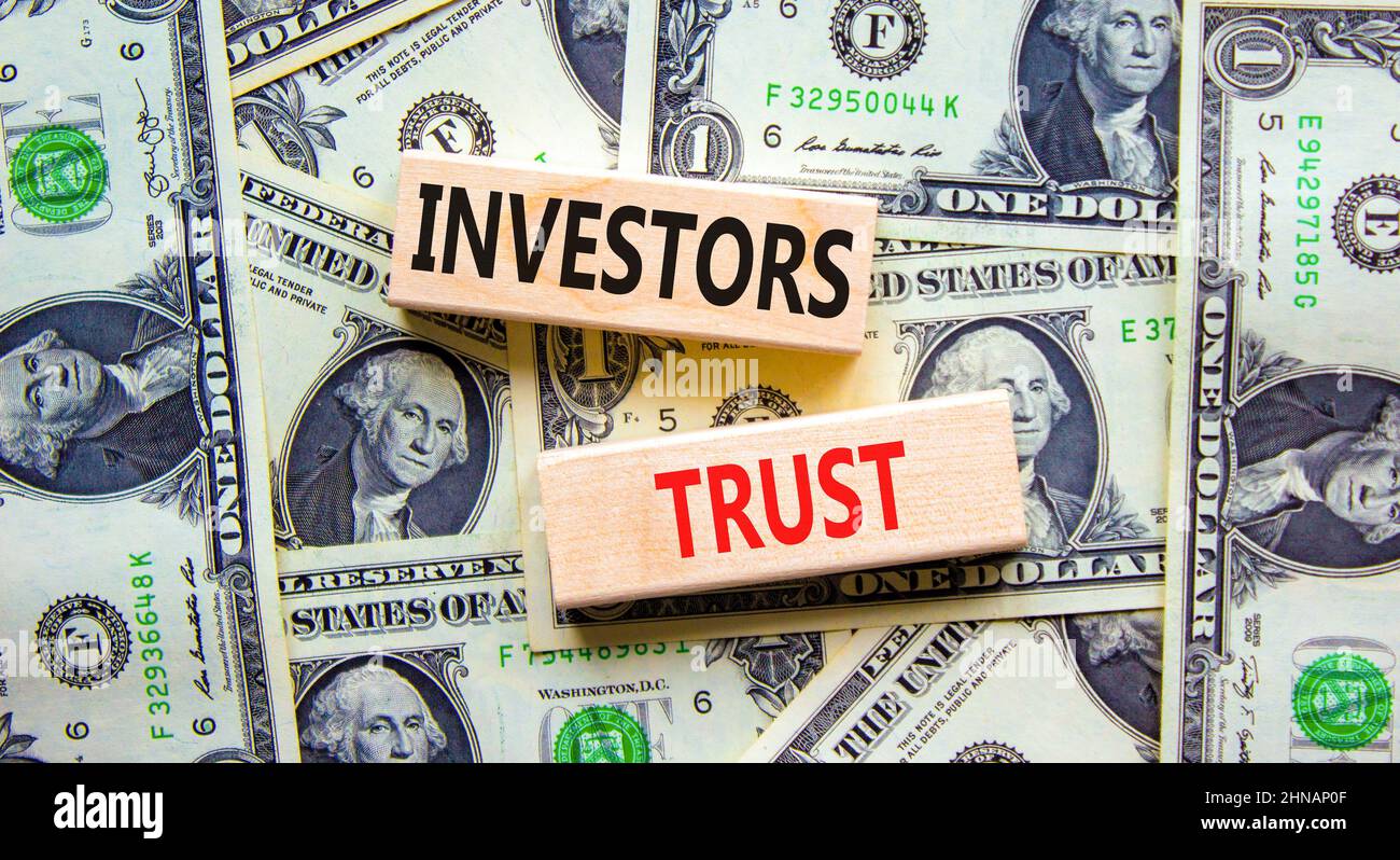 Investors trust symbol. Concept words Investors trust on wooden blocks ...