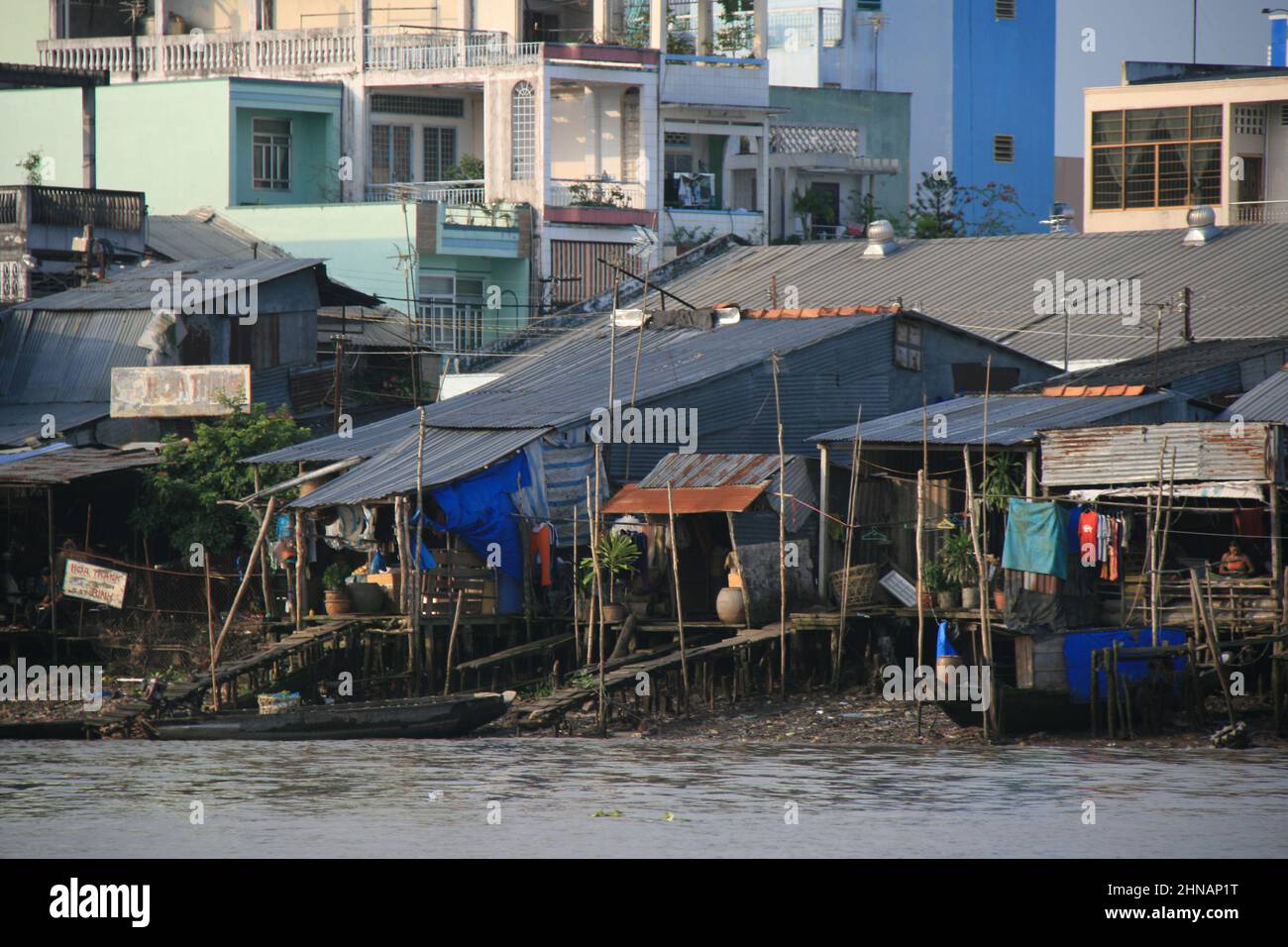 town and slum along a river in the mekong delta in south vietnam Stock ...