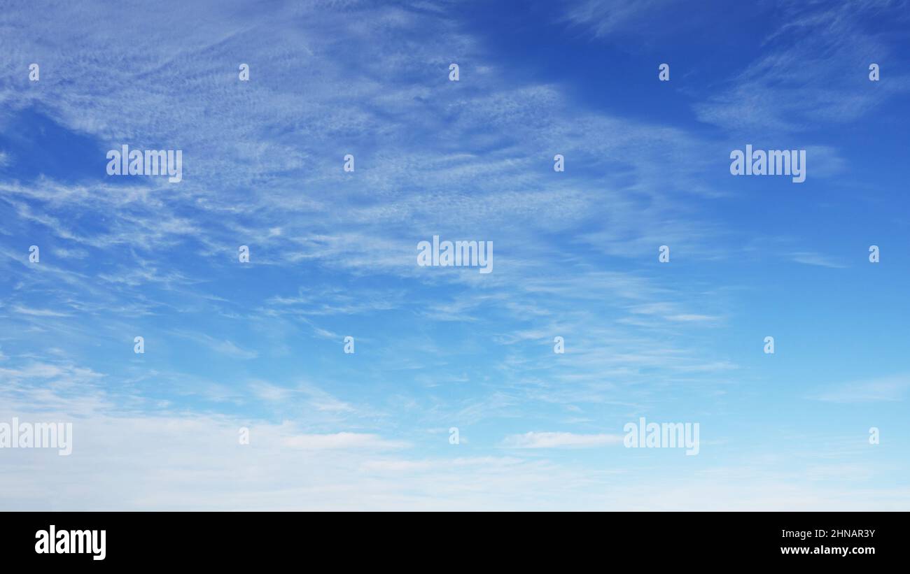 WIspy clouds and blue sky suitable for background Stock Photo - Alamy