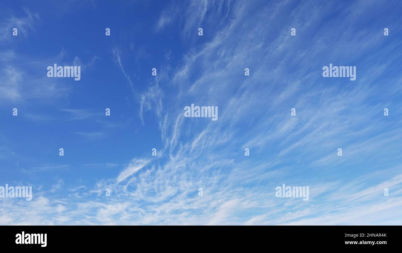 WIspy clouds and blue sky suitable for background Stock Photo - Alamy