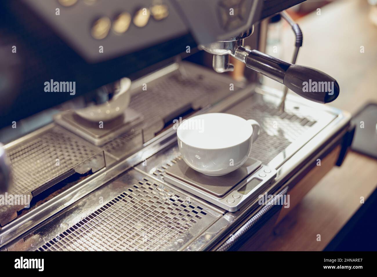 Professional coffee machine with cup in cafeteria Stock Photo - Alamy