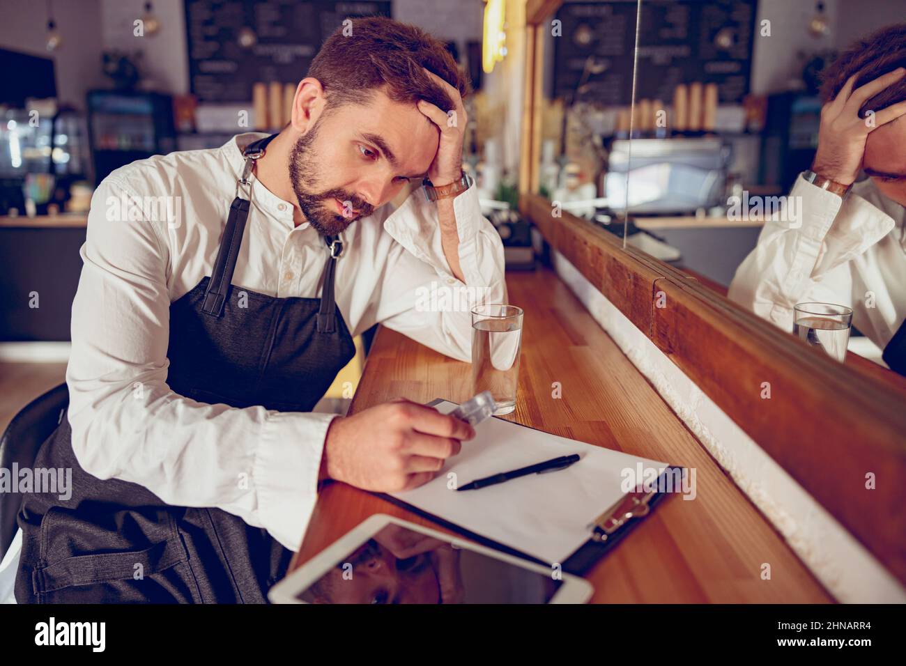 Young tired male barista people hi-res stock photography and images - Alamy