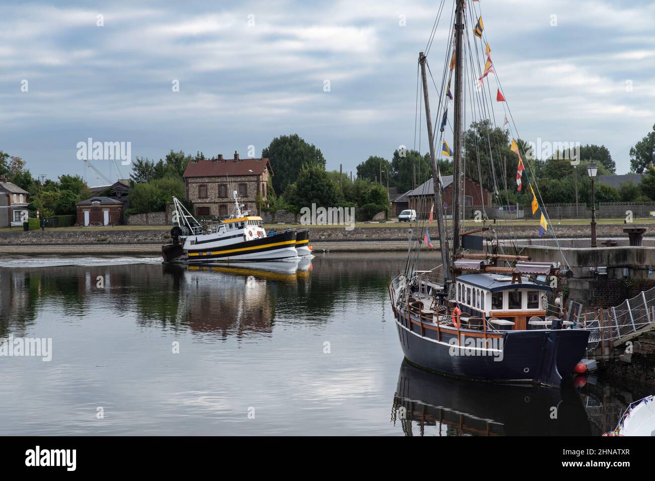 A fishing boat enters the port in Normandy, France Stock Photo - Alamy