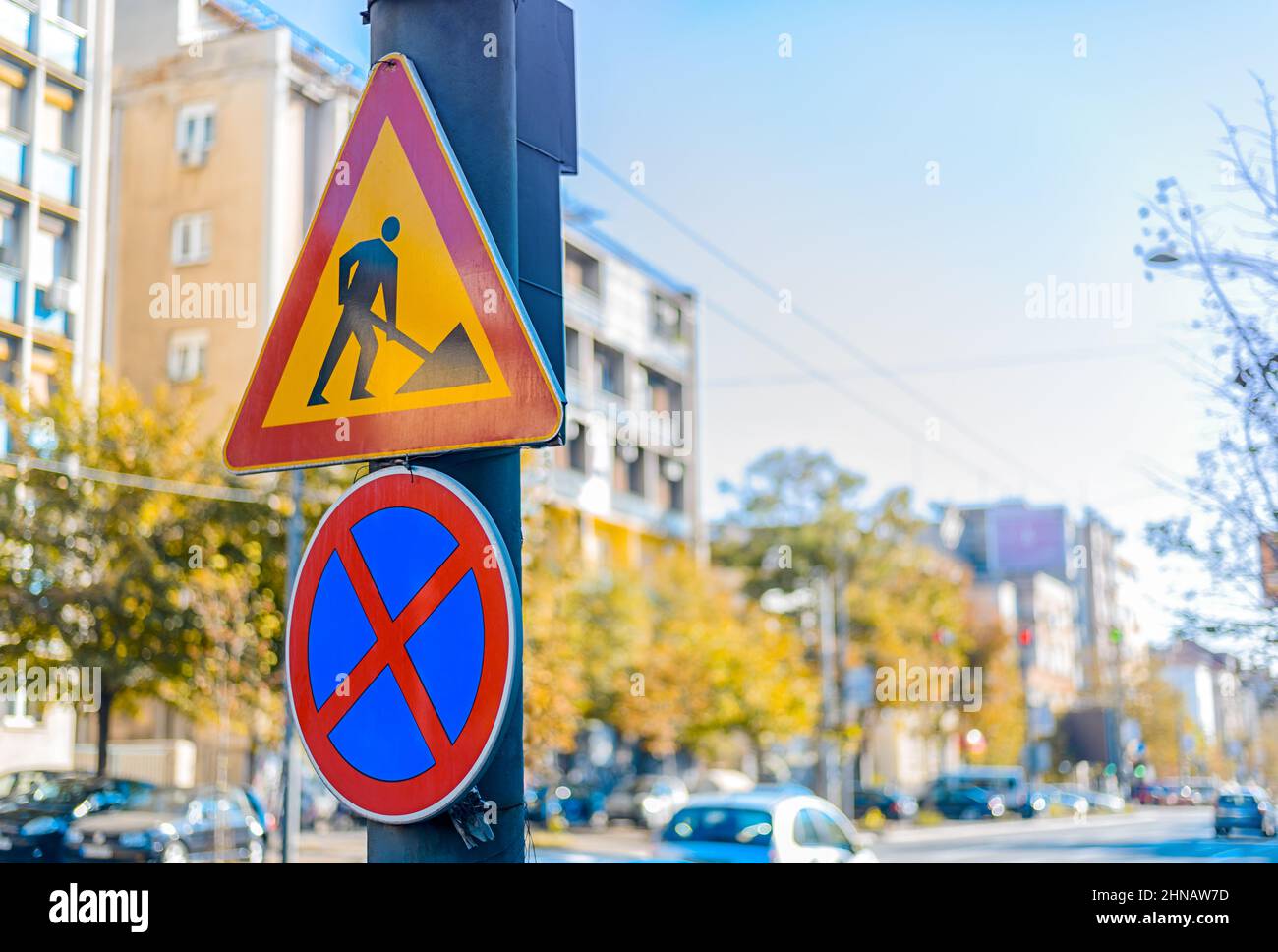 Some signs for work in progress on urban street with no parking sign ...