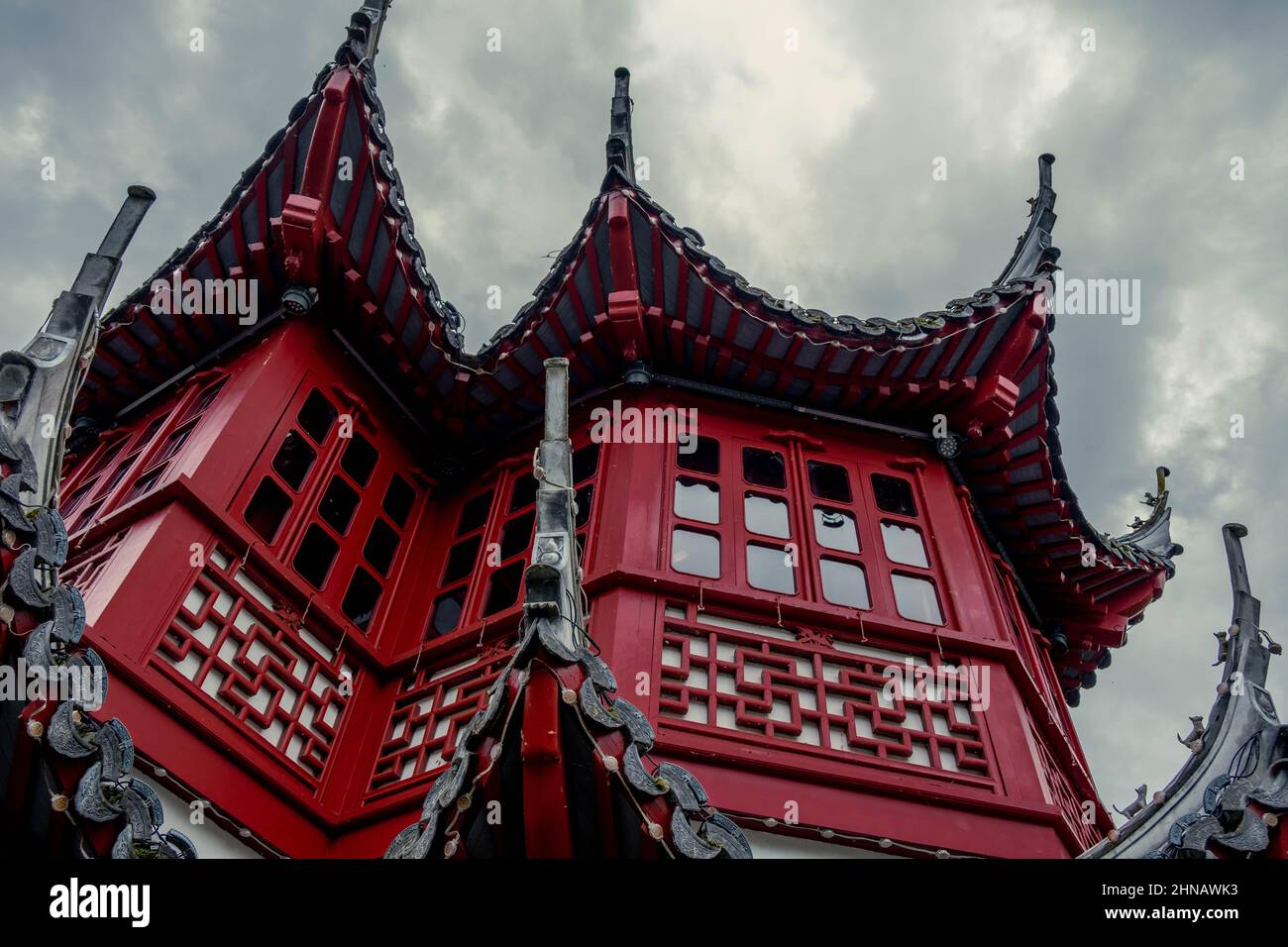 Low angle shot of the Japanese architectural red building on a cloudy ...