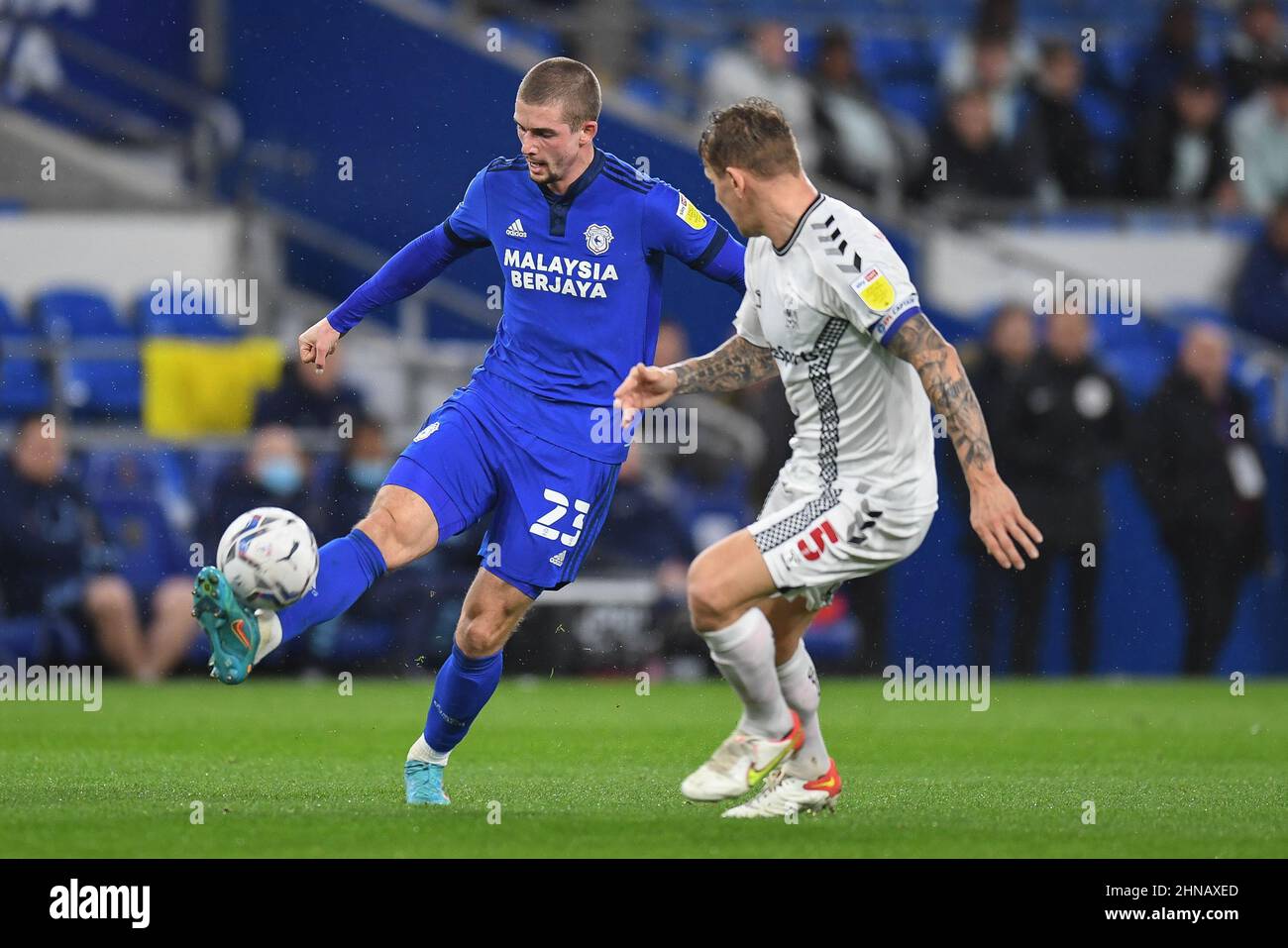 Max Watters #23 of Cardiff City takes on Kyle McFadzean #5 of Coventry ...