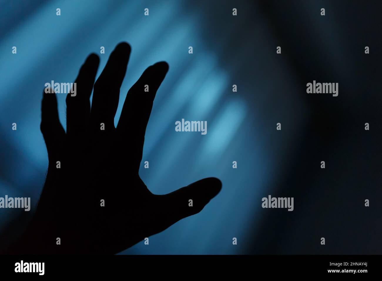 Dark hand shadow reaching into the unknown Stock Photo - Alamy