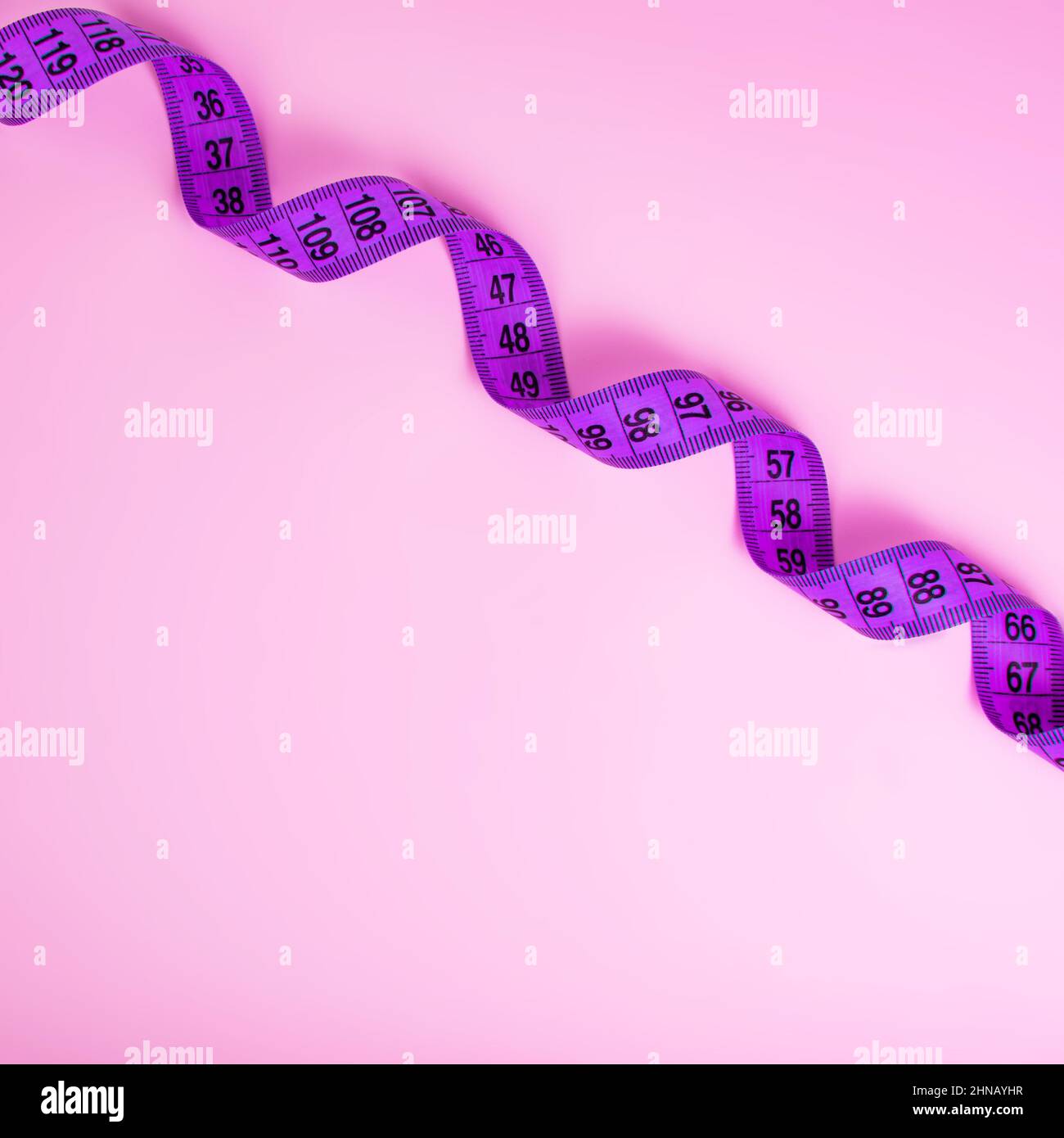 Bright purple tape measure on violet background with copyspace Stock ...