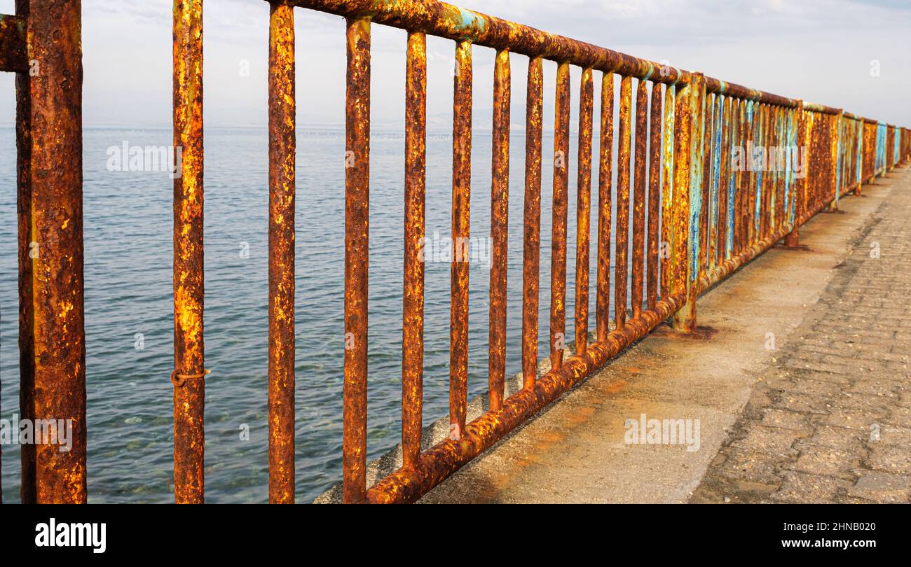 Rusty iron railing, beautiful sea and sky landscape view between ...