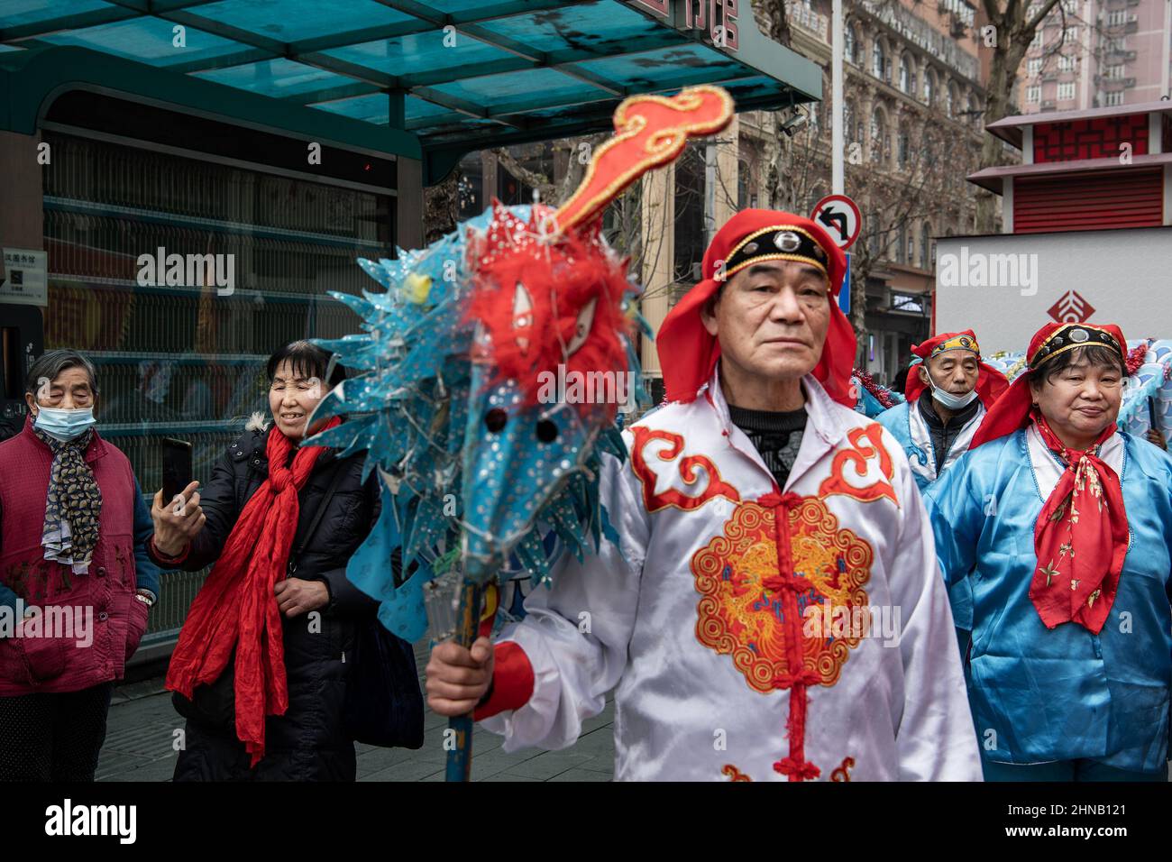 Traditional dragon dance performers wait before a show for the Lantern ...
