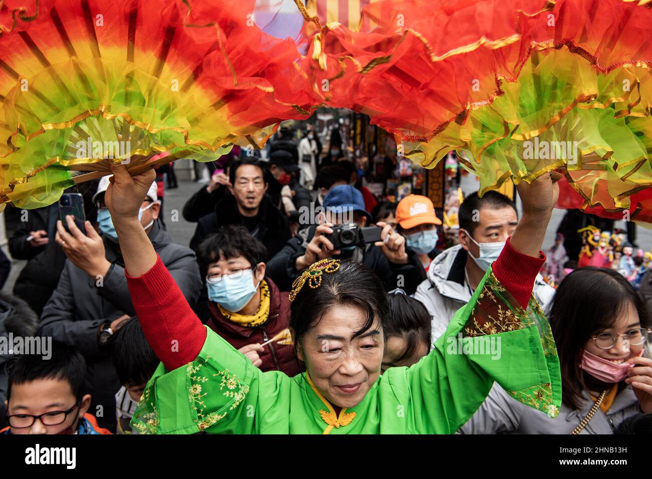 People watch a traditional dragon dance show for the Lantern Festival ...