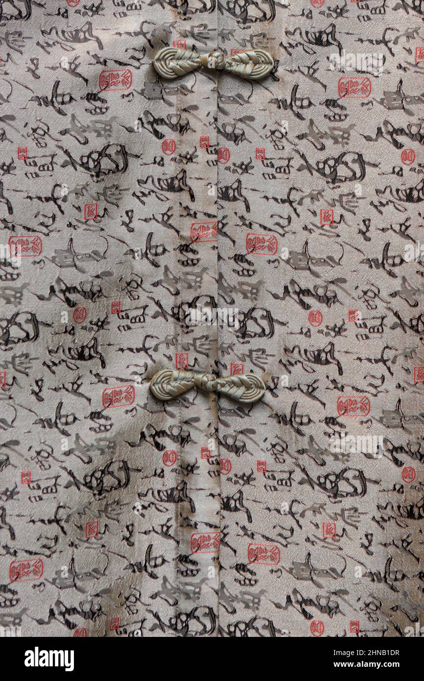 Grey silk cloth as background in chinese shop Stock Photo - Alamy