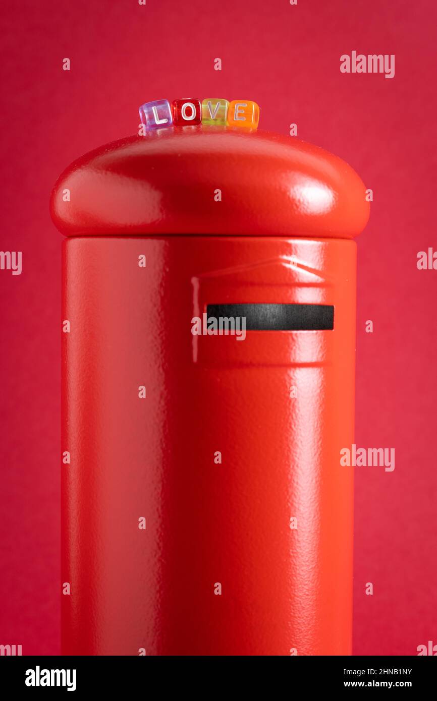 Closeup of a red mailbox on a red background for a valentine letters ...