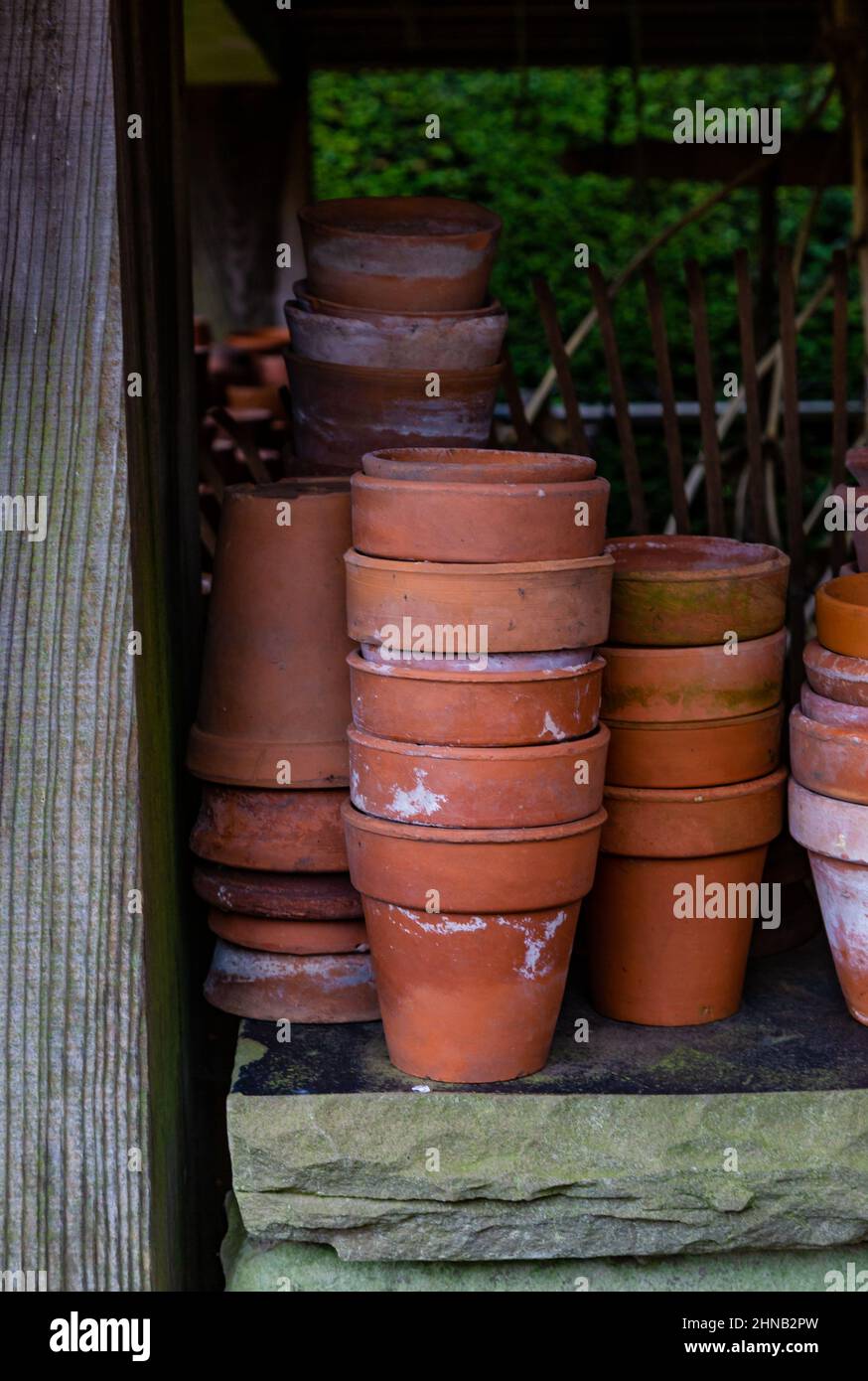 Clay garden plant pots stacked up in storage Stock Photo - Alamy
