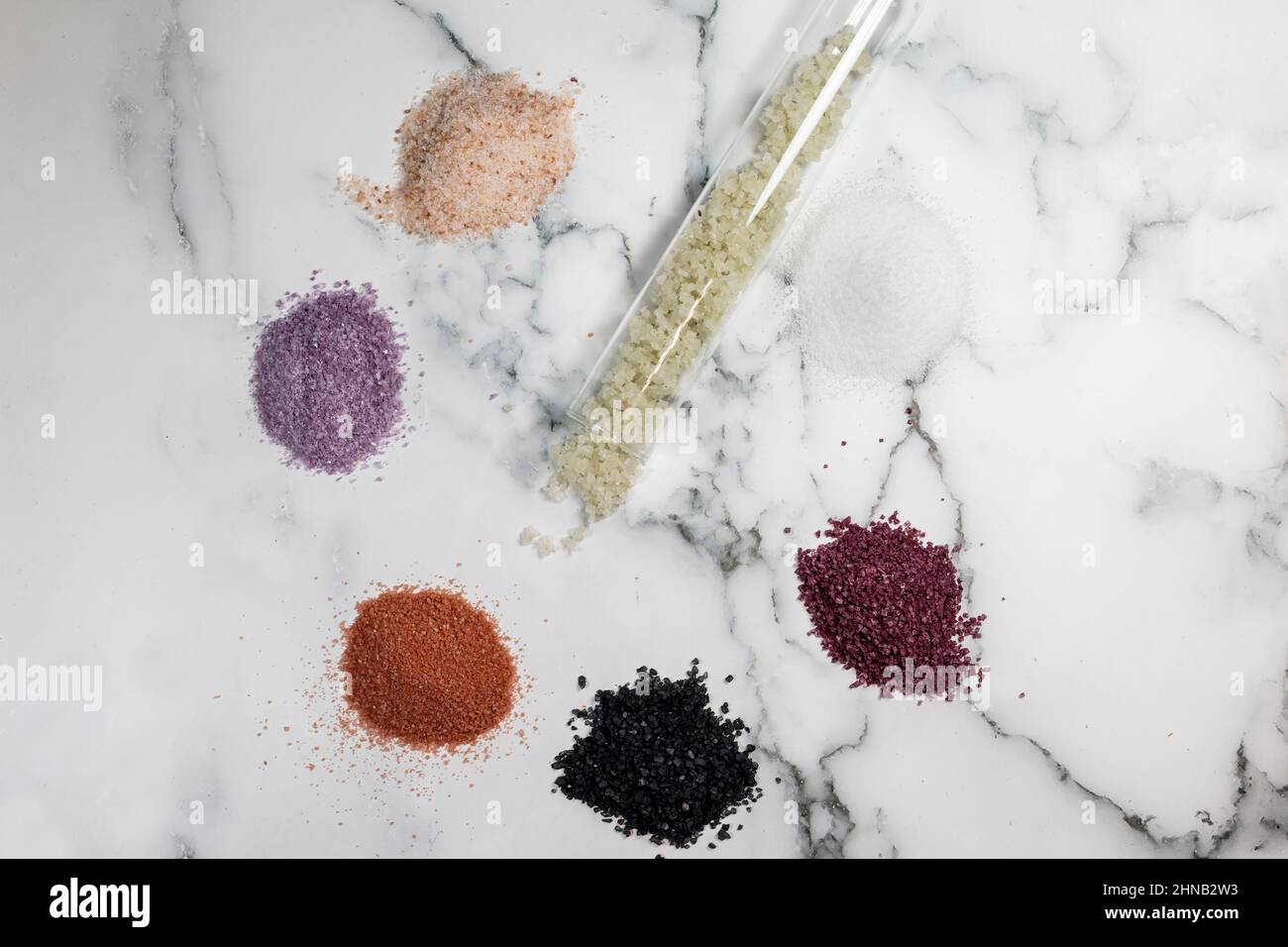 Marble counter top background with various red, pink Himalayan, purple ...