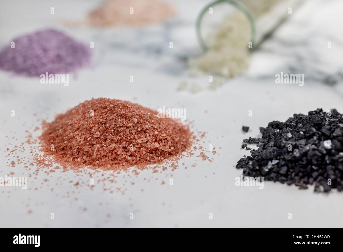 Marble counter top background with various red, pink Himalayan, purple ...