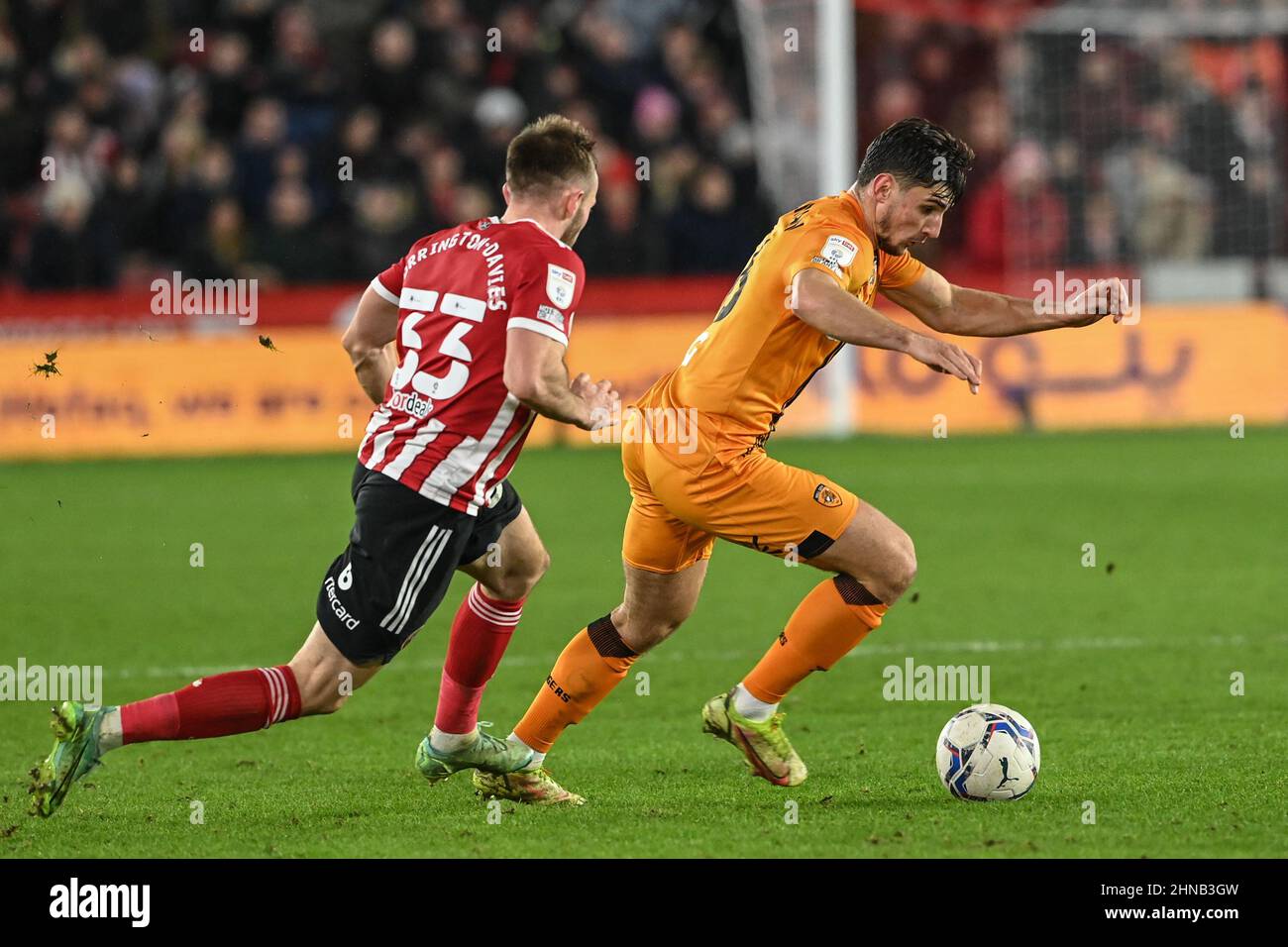 Ryan Longman #16 of Hull City breaks as Rhys Norrington-Davies #33 of ...
