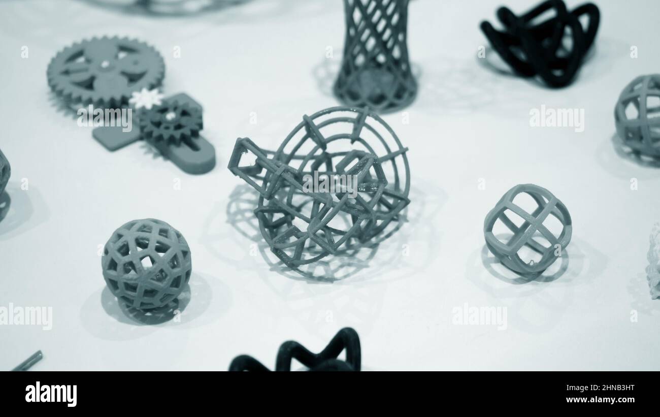 Many abstract models bright colorful objects printed on a 3d printer ...