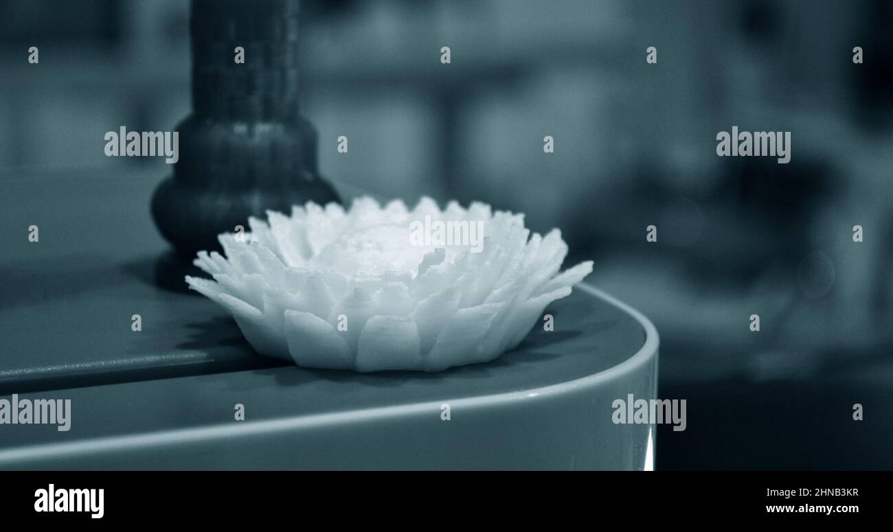 Abstract isolated object flower of yellow color printed on 3d printer ...