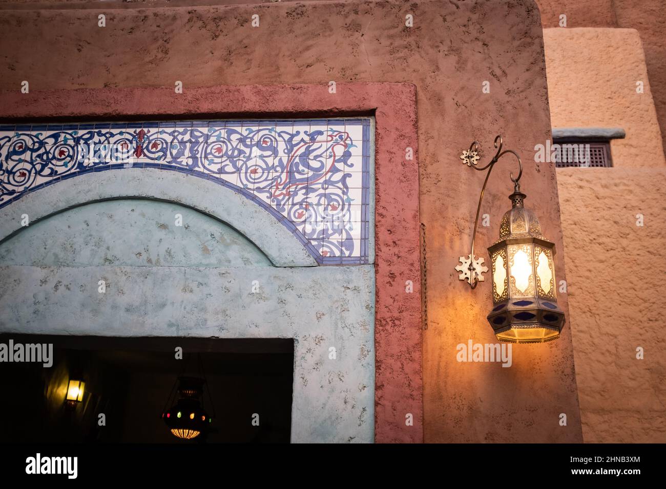 Middle east building feature with mud walls and yellow lamp decoration ...