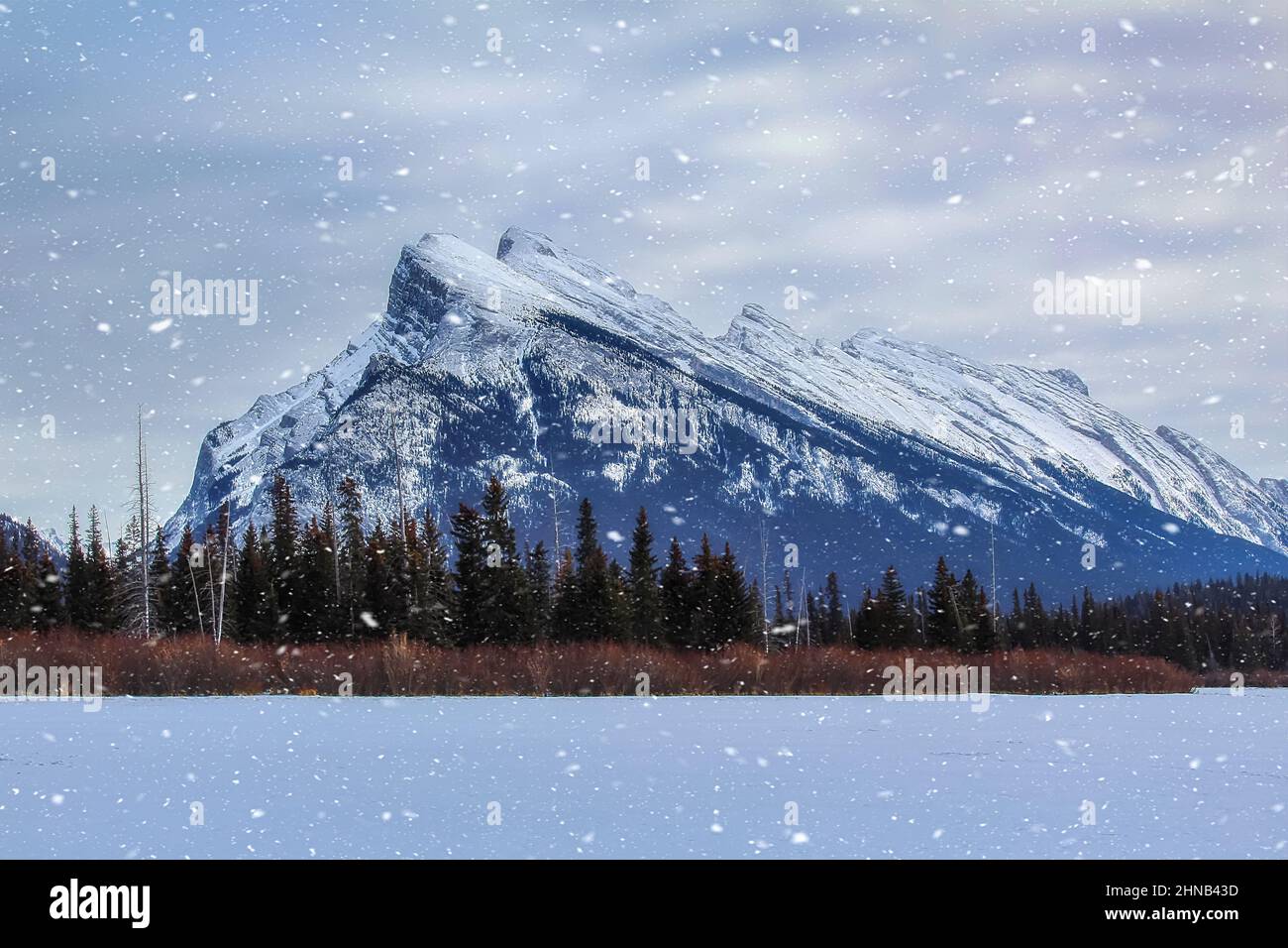 Snow Falling Over Banff Mountains Stock Photo - Alamy