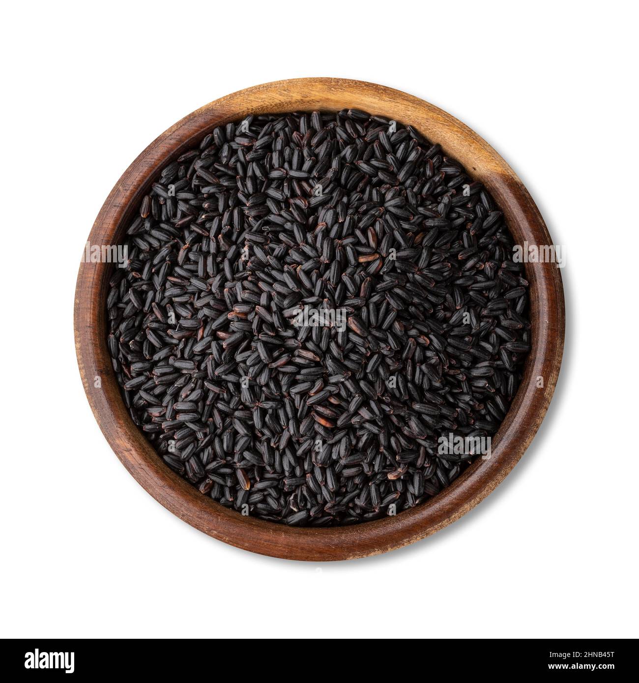 Raw black rice in a bowl isolated over white background Stock Photo - Alamy