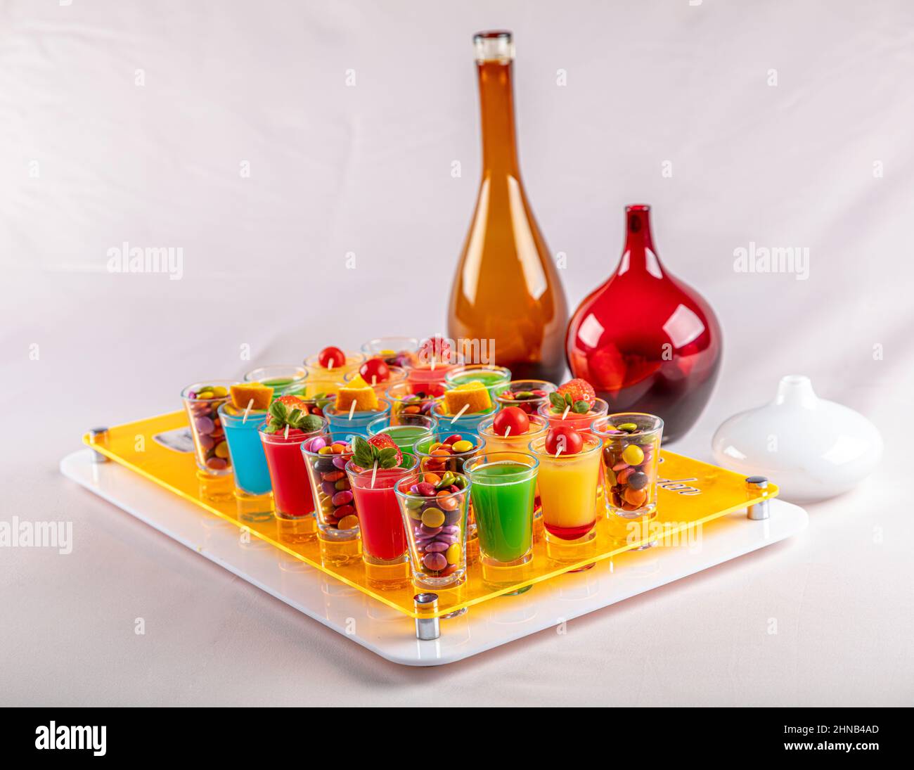 Variety of colorful green blue yellow red and white beautiful alcohol ...