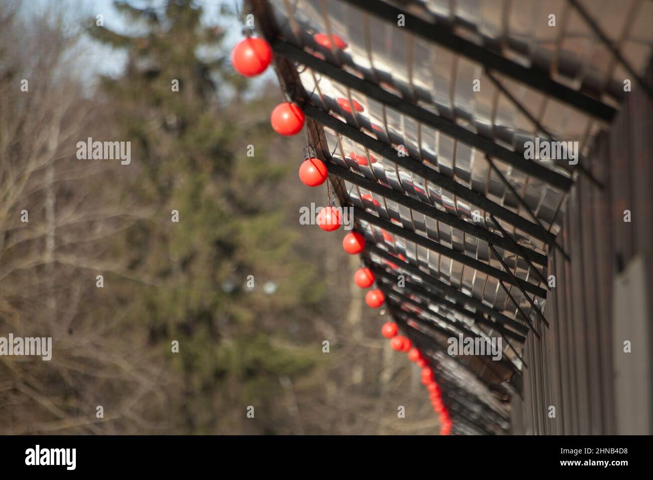 Fence at construction site. Red lights on fence. Construction site ...
