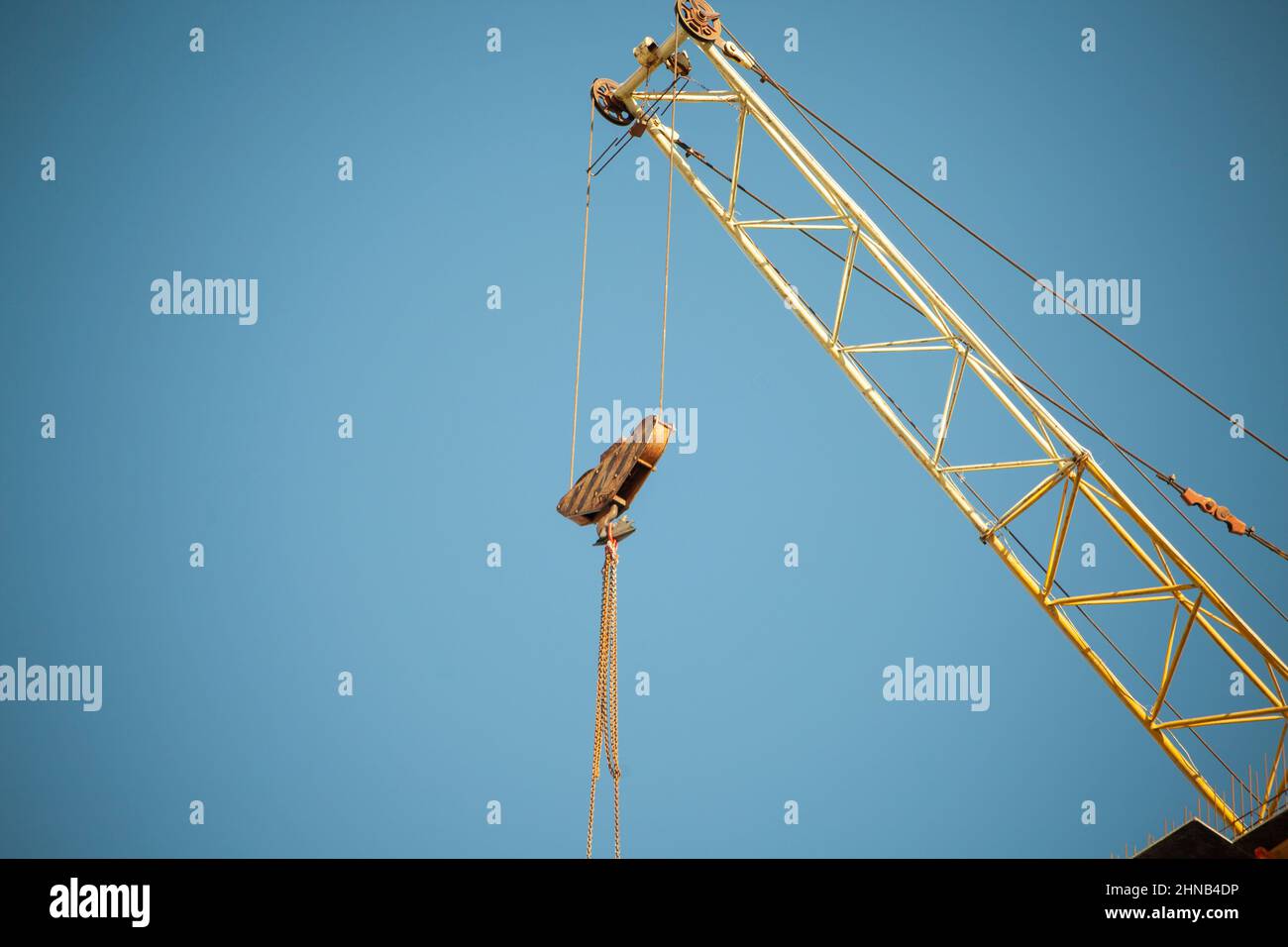 Crane. Heavy machinery. Hook for cargo. Arrow to hold cable. Steel rope ...