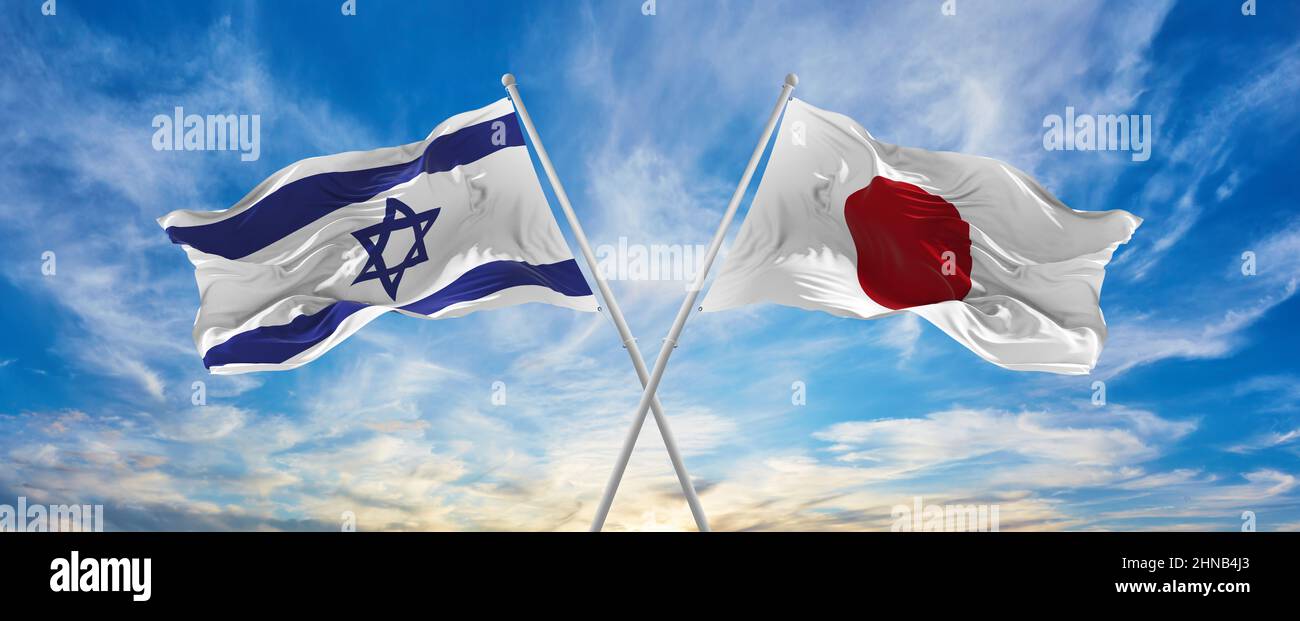 crossed national flags of Israel and japan flag waving in the wind at ...