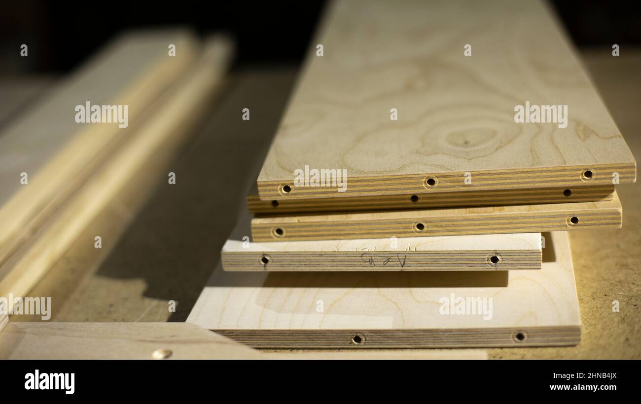 Boards in carpentry workshop. Raw wood. Details of furniture creation ...