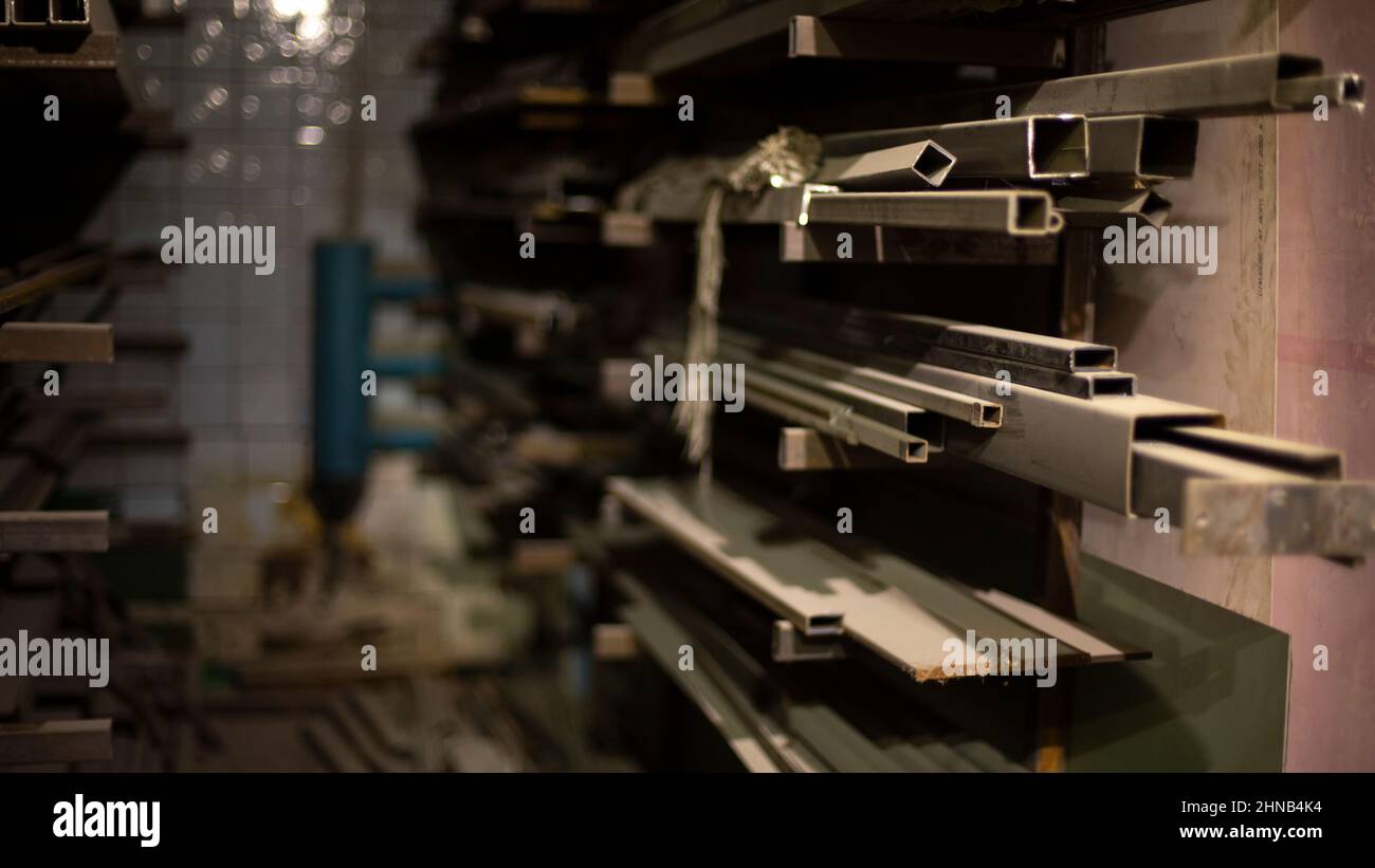 Steel profile on shelves. Metal storage details. Warehouse in shop ...