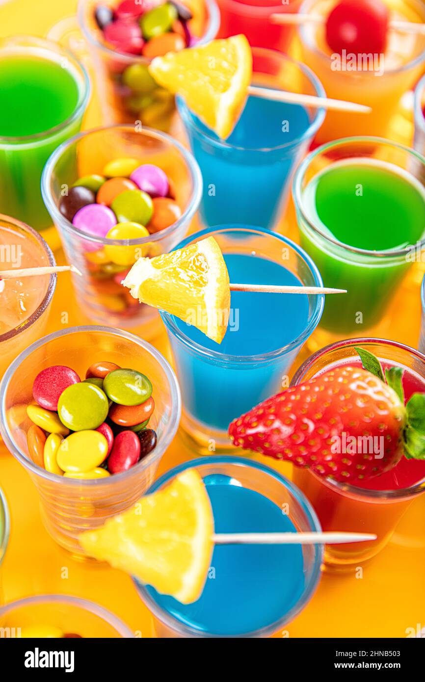 Variety of colorful green blue yellow red and white beautiful alcohol ...