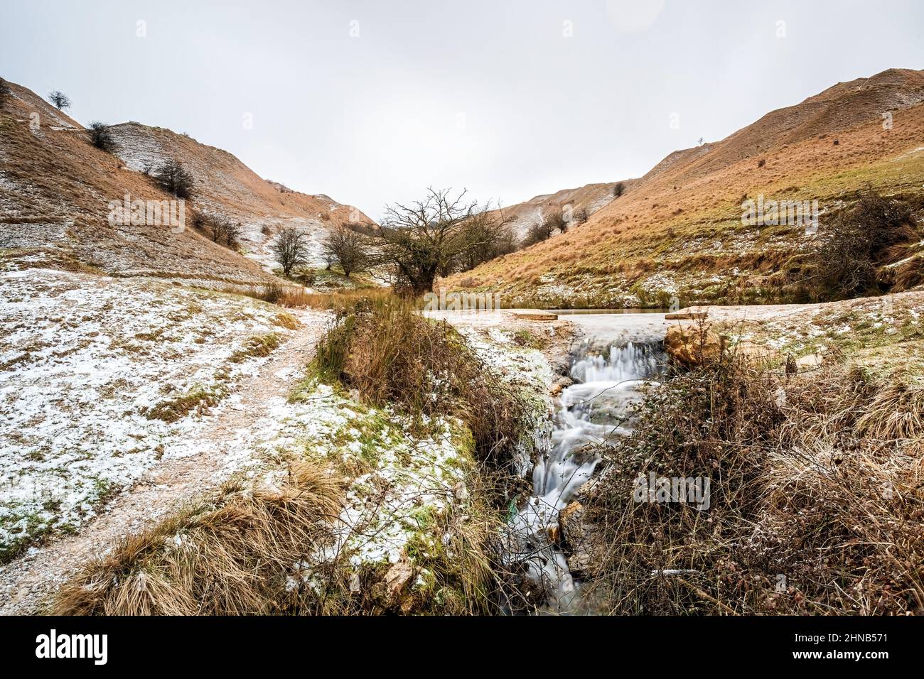Frozen winter scene of the wash pool on Cleeve Hill, Gloucestershire ...