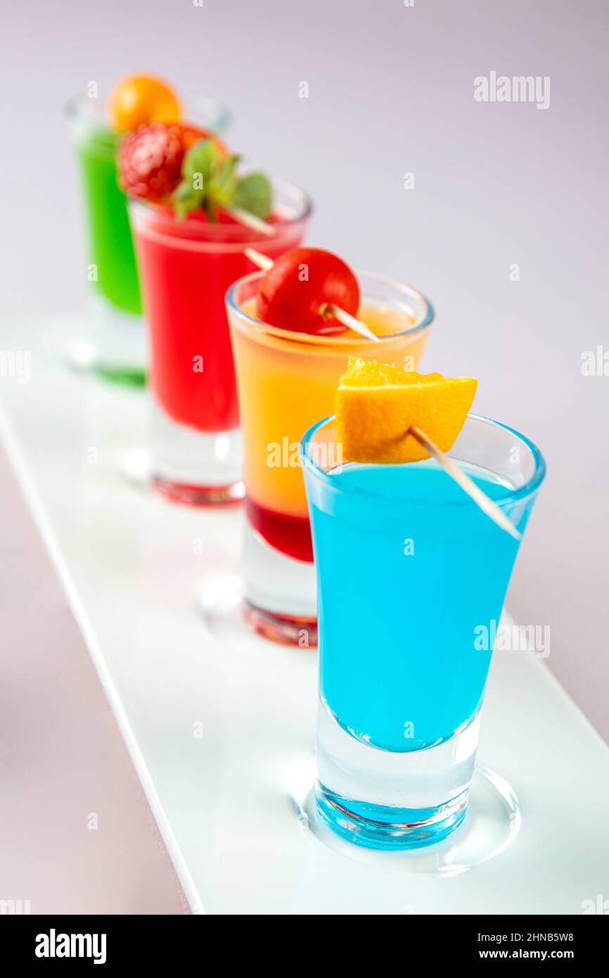 Variety of colorful green blue yellow red and white beautiful alcohol ...